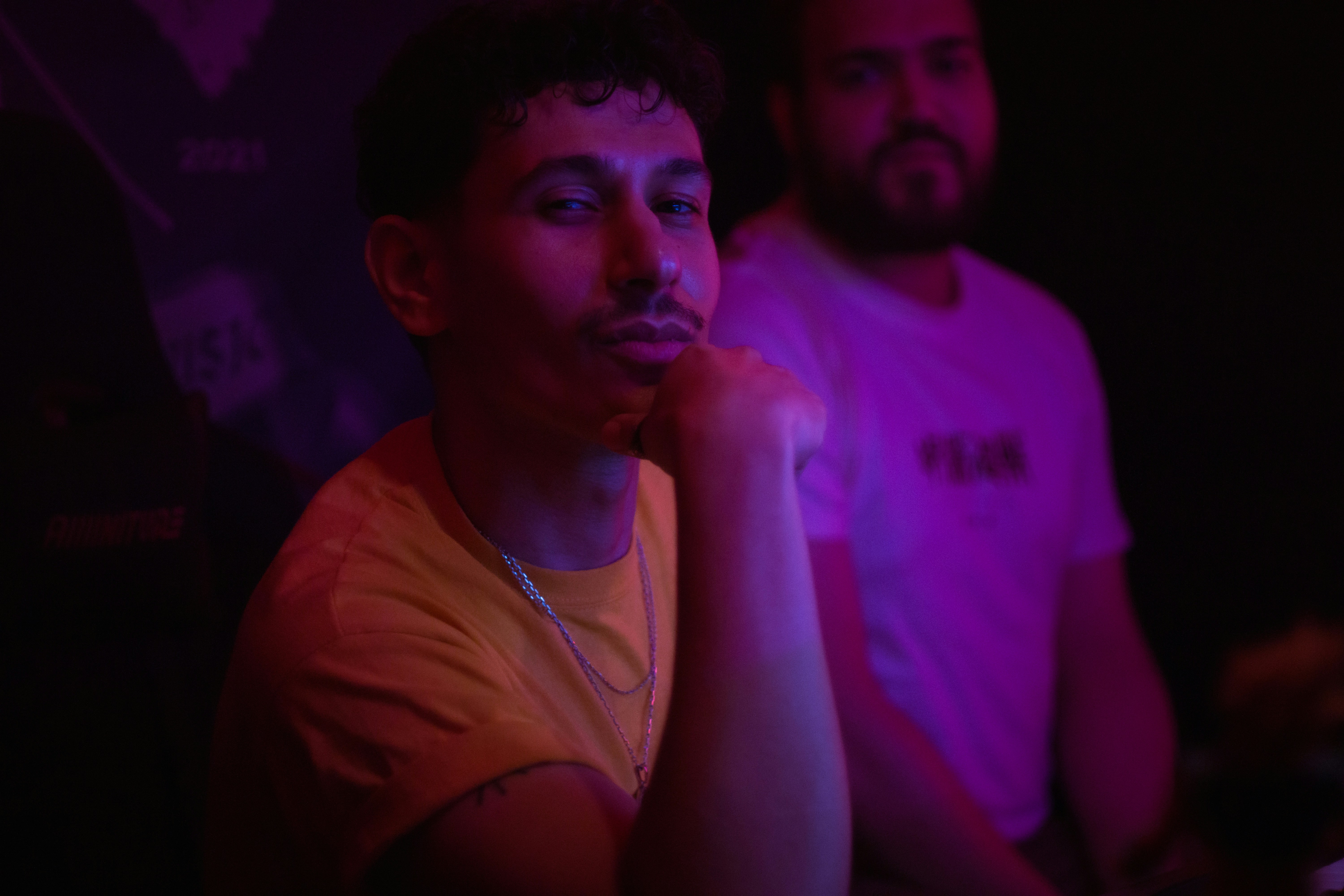 Crimson Contemplation: A Quiet Portrait in Neon Velvet