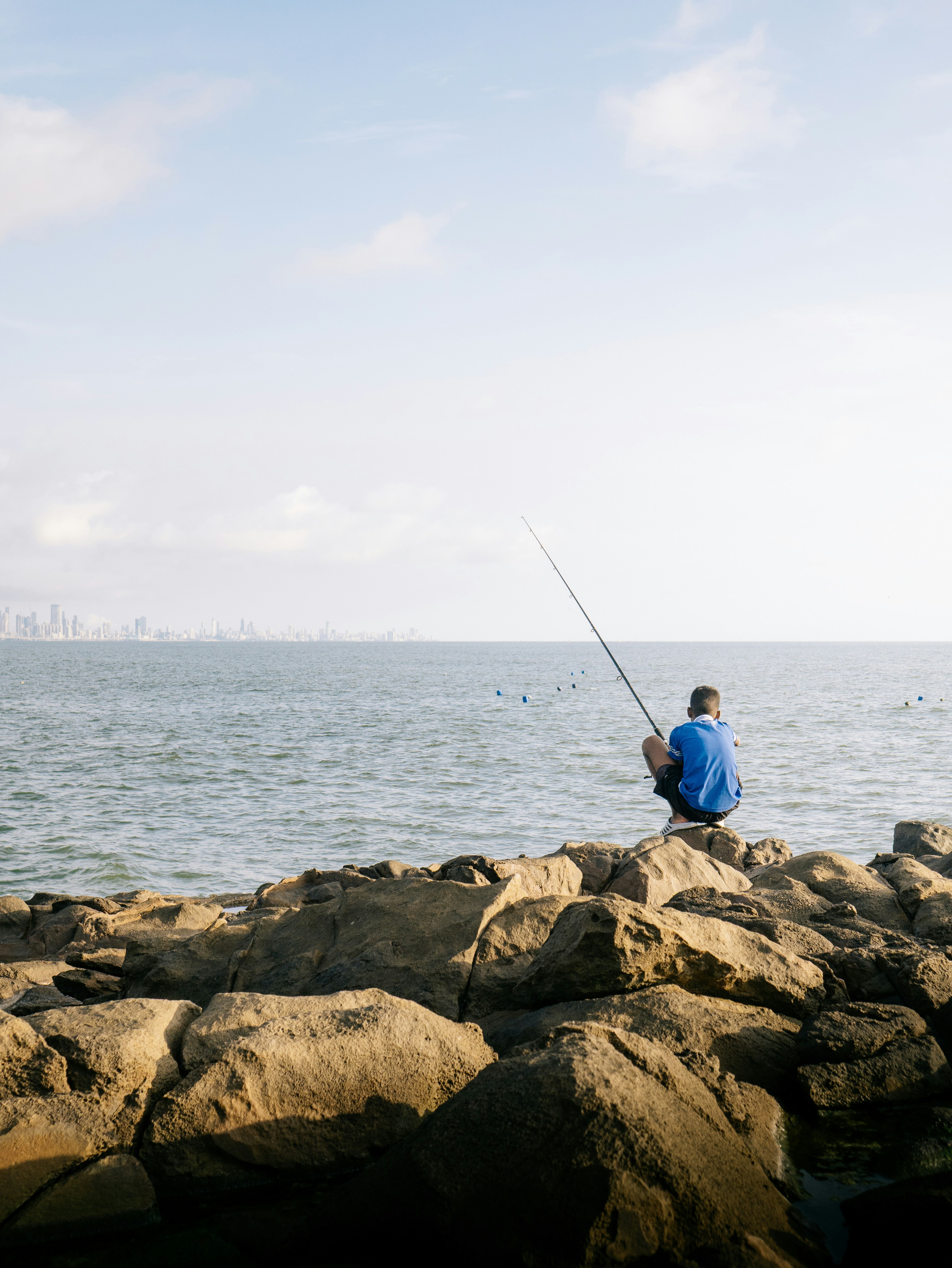 Serenity by the Shore: A Young Angler's Retreat