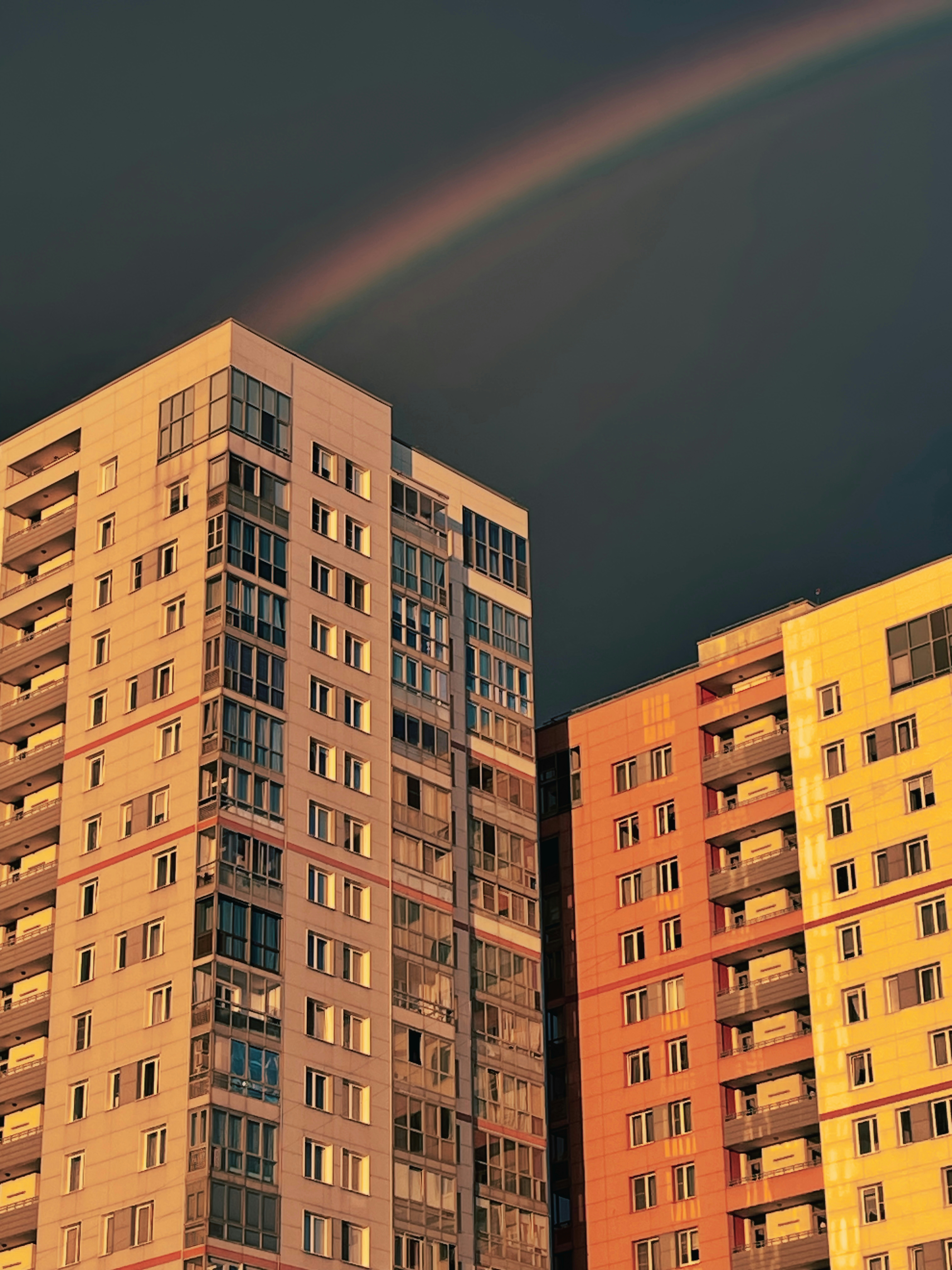 Urban Symphony Beneath a Rainbow