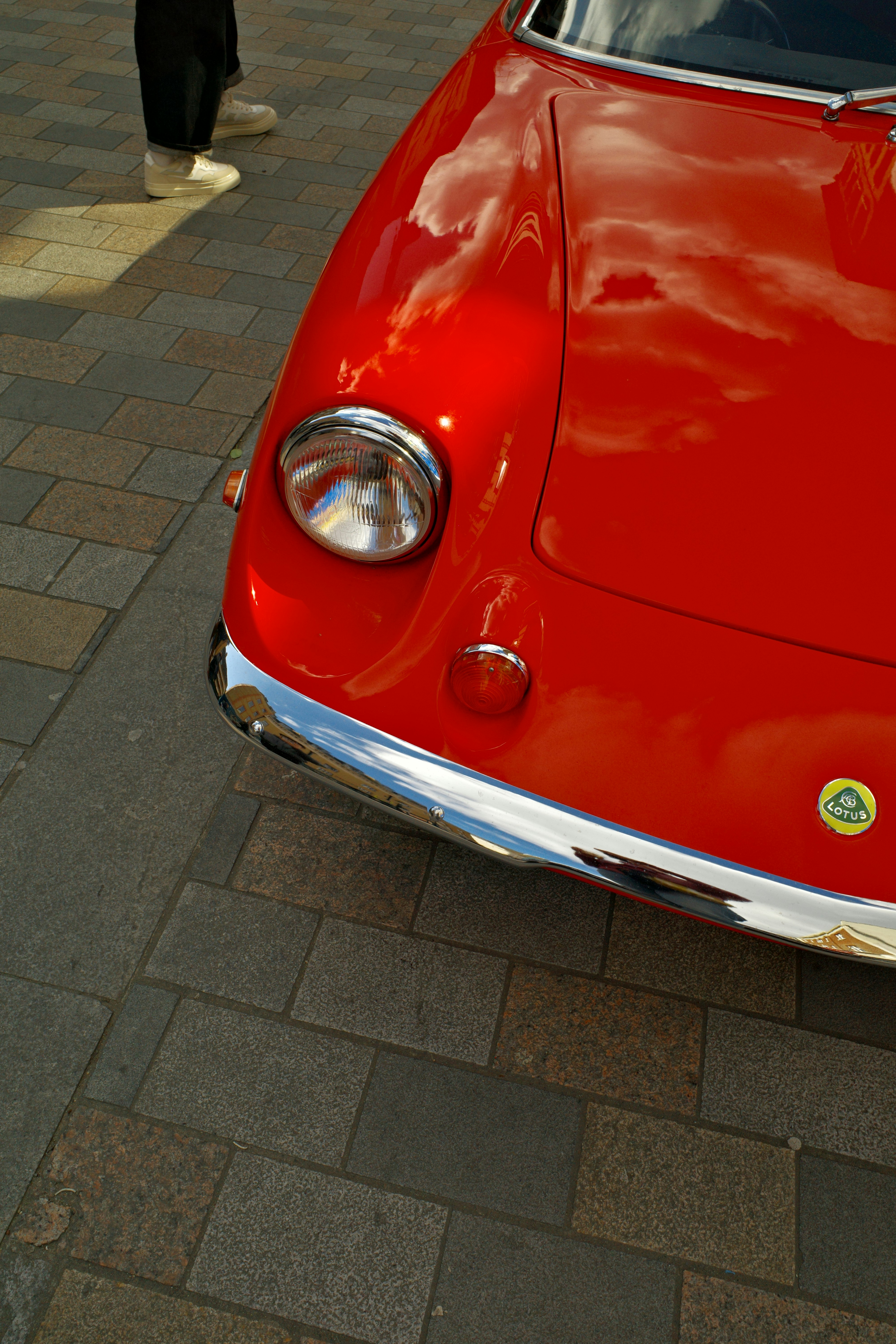 Red vintage sports car with chrome accents.