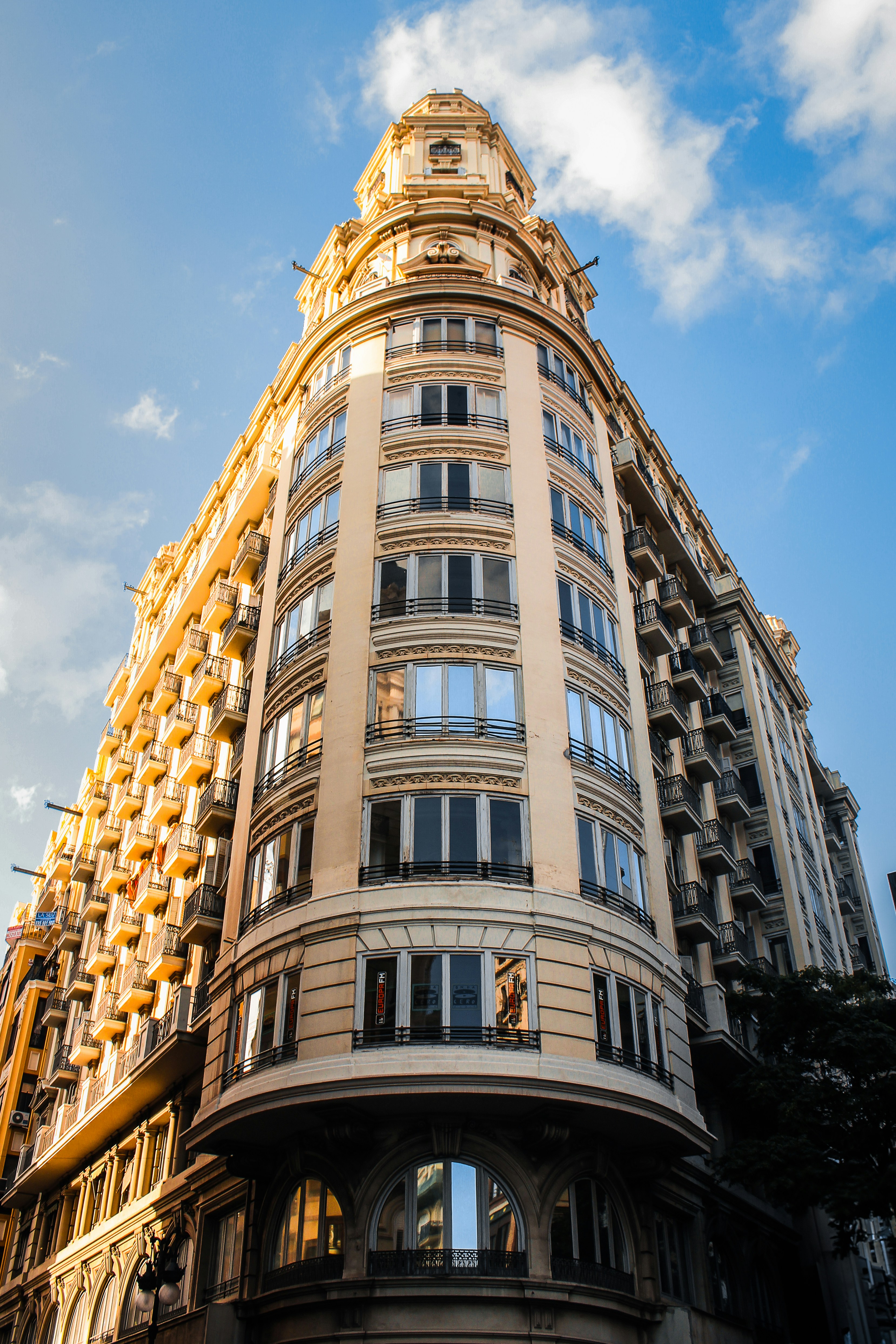 Ornate building with many windows under a blue sky