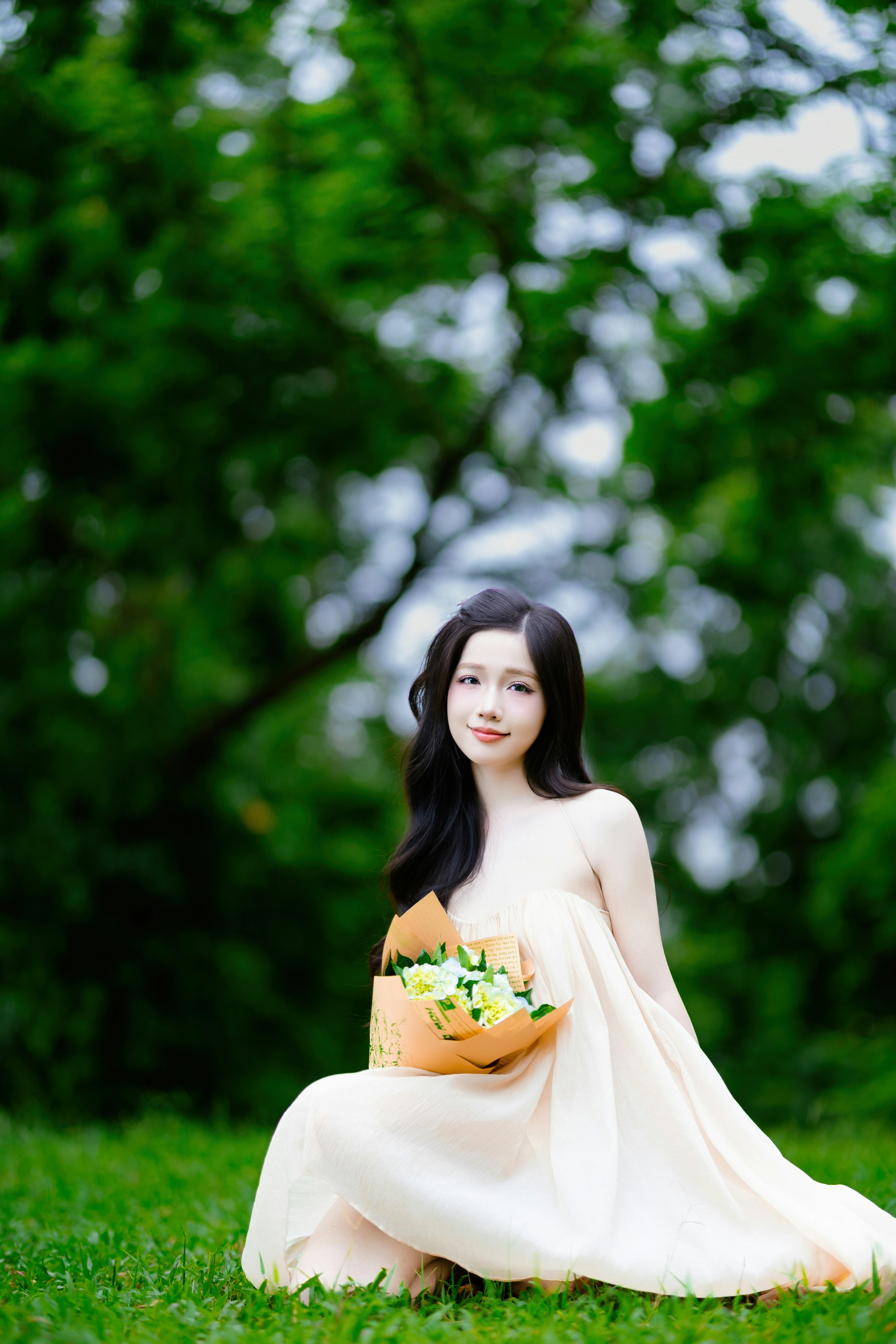 Elegant portrait of a young woman holding a bouquet of hydrangeas in a green garden. Natural light photography, soft tones, spring vibes. | Young woman holding flowers in a grassy park