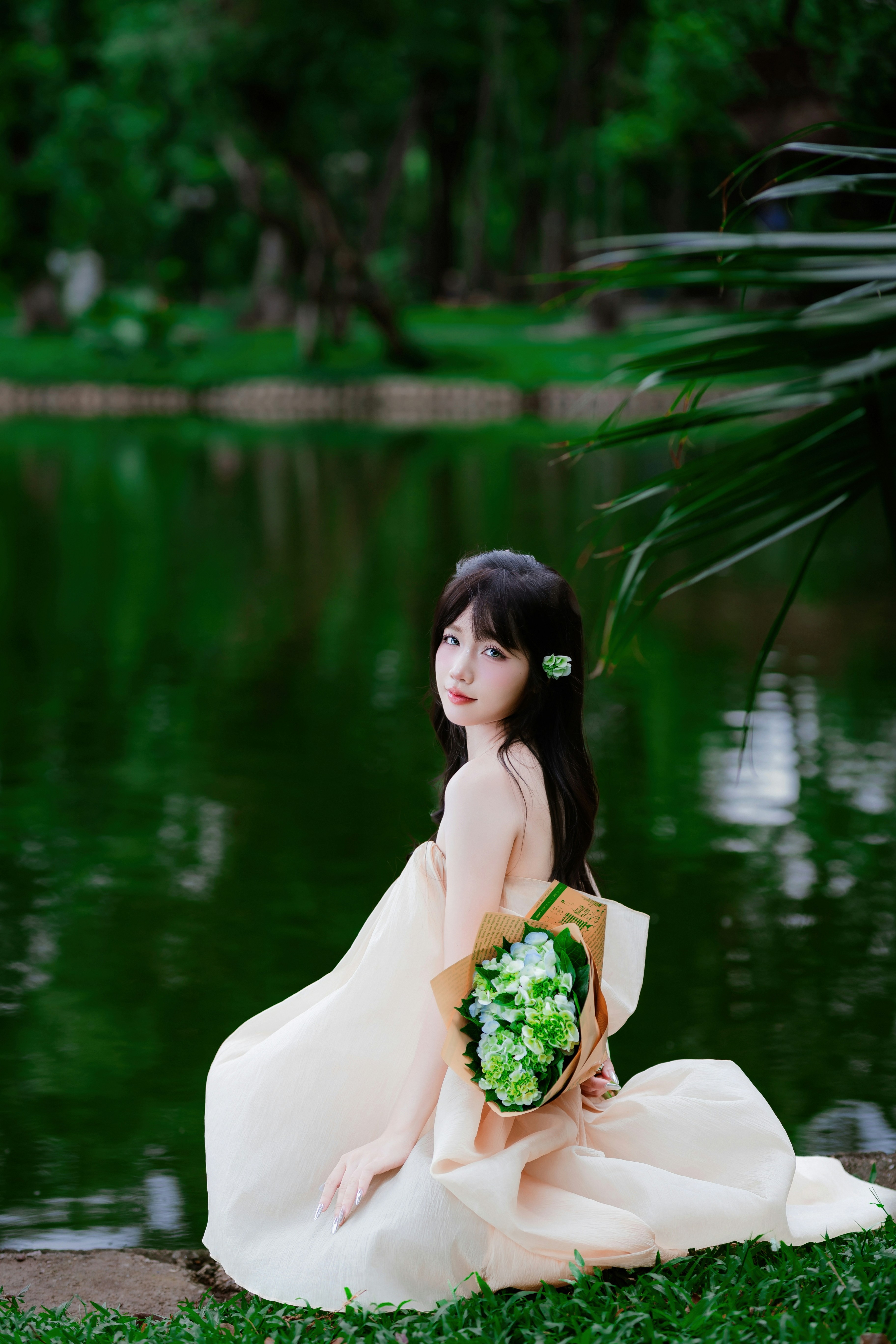 Elegant portrait of a young woman holding a bouquet of hydrangeas in a green garden. Natural light photography, soft tones, spring vibes.