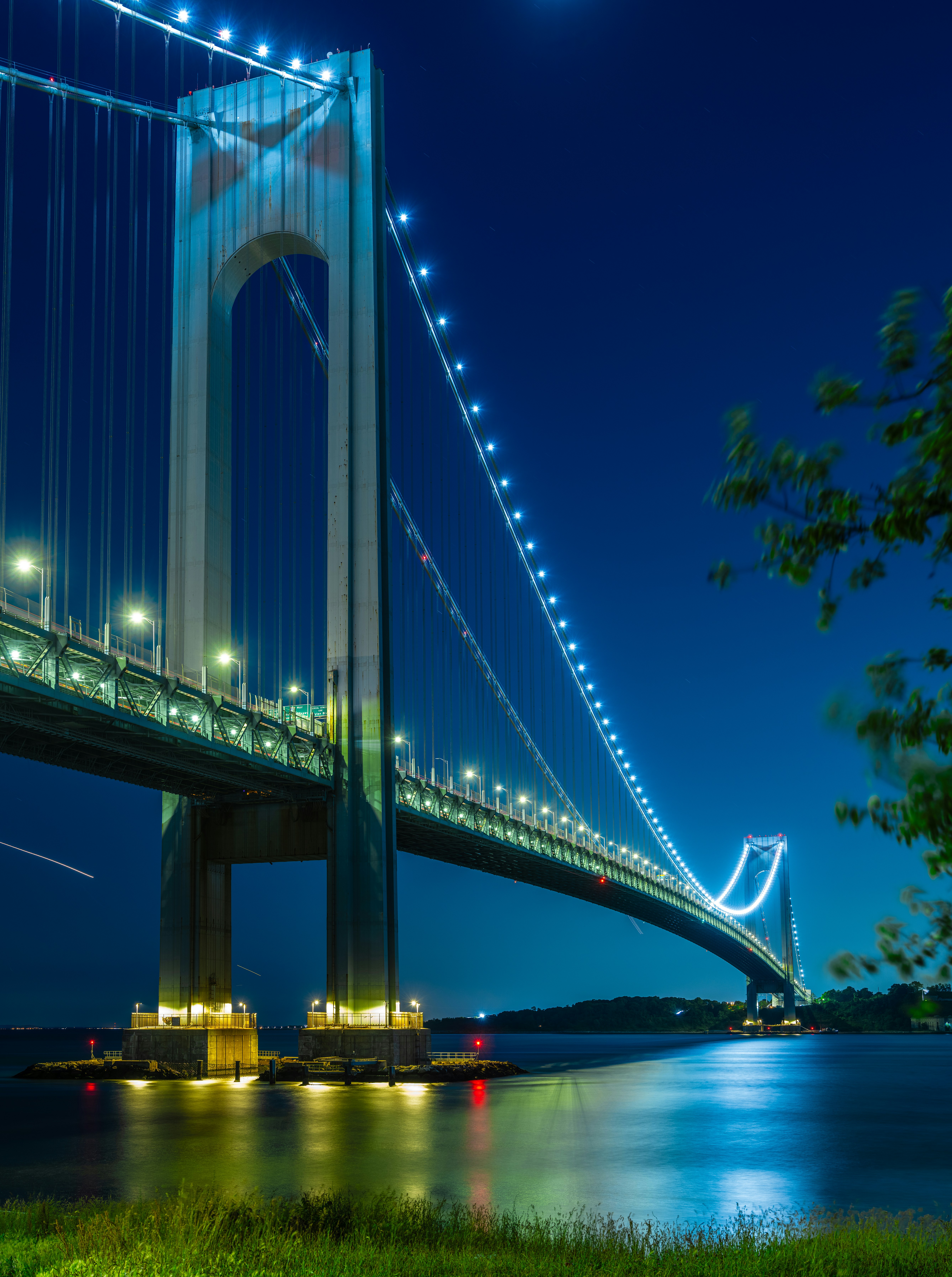Verrazzano-Narrows bridge at night | Illuminated suspension bridge at night over water