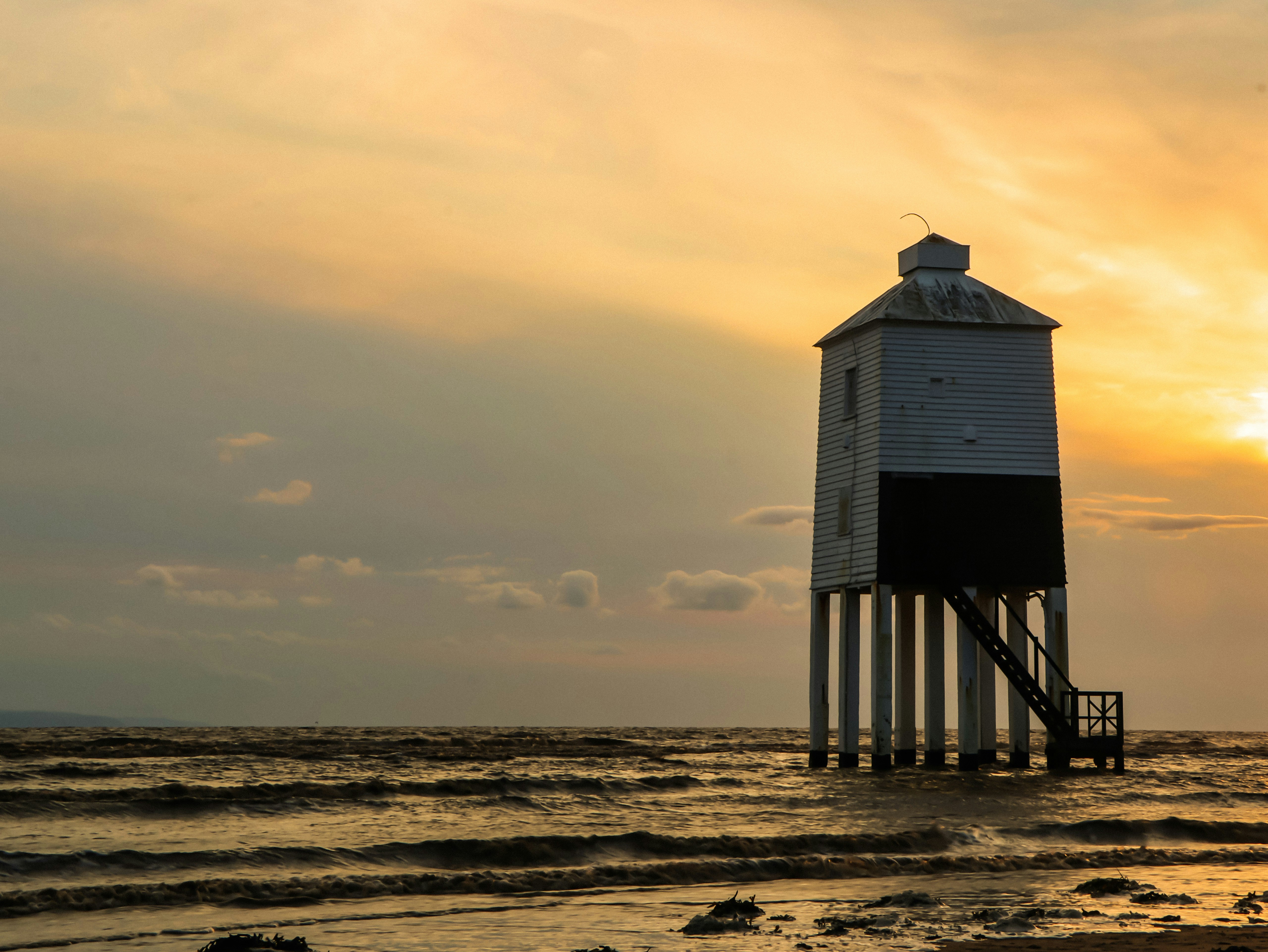 Solitary Sentinel: The Lighthouse at Dusk