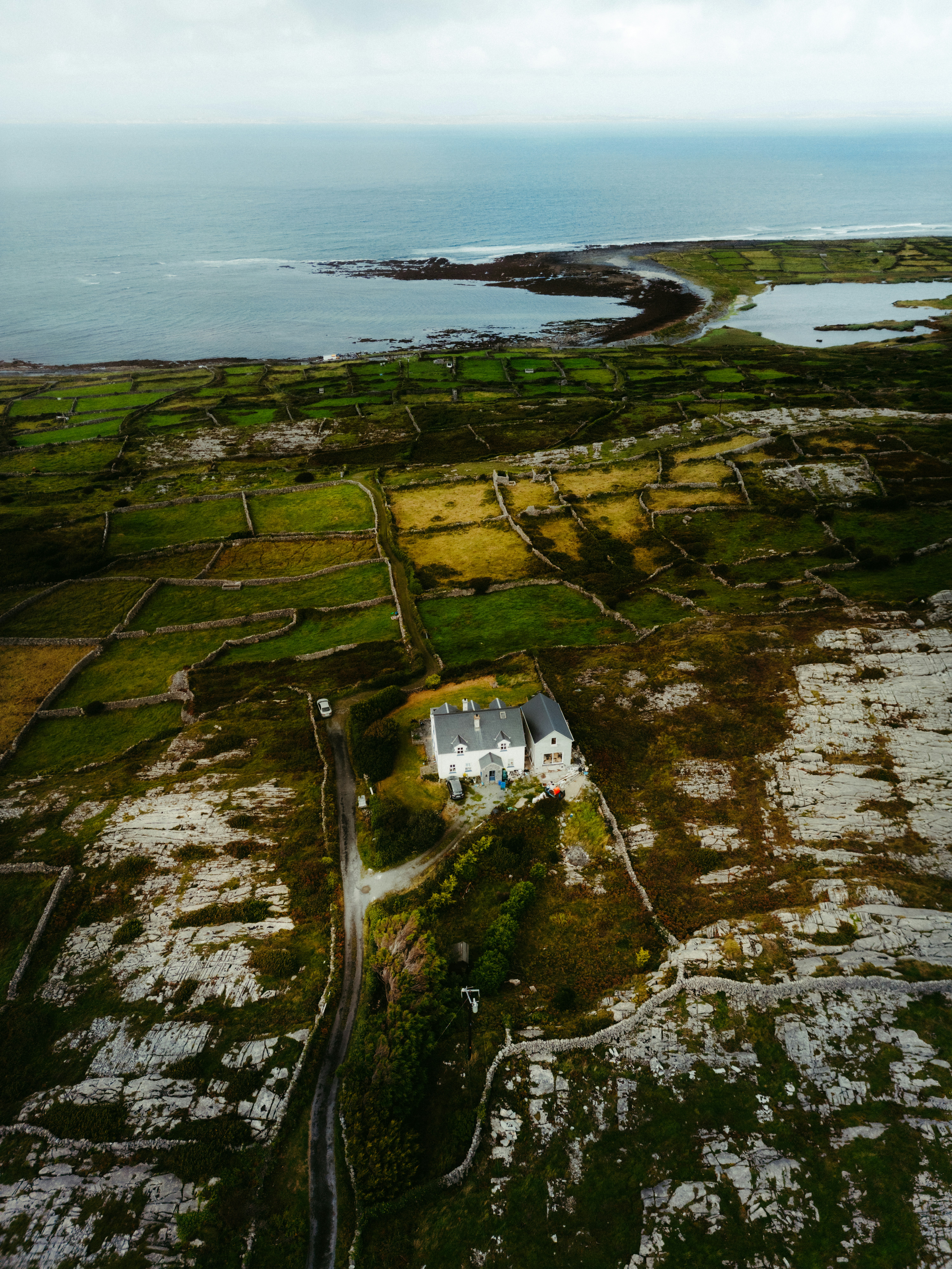 Isolated Serenity: A Coastal Retreat Amidst Patchwork Fields