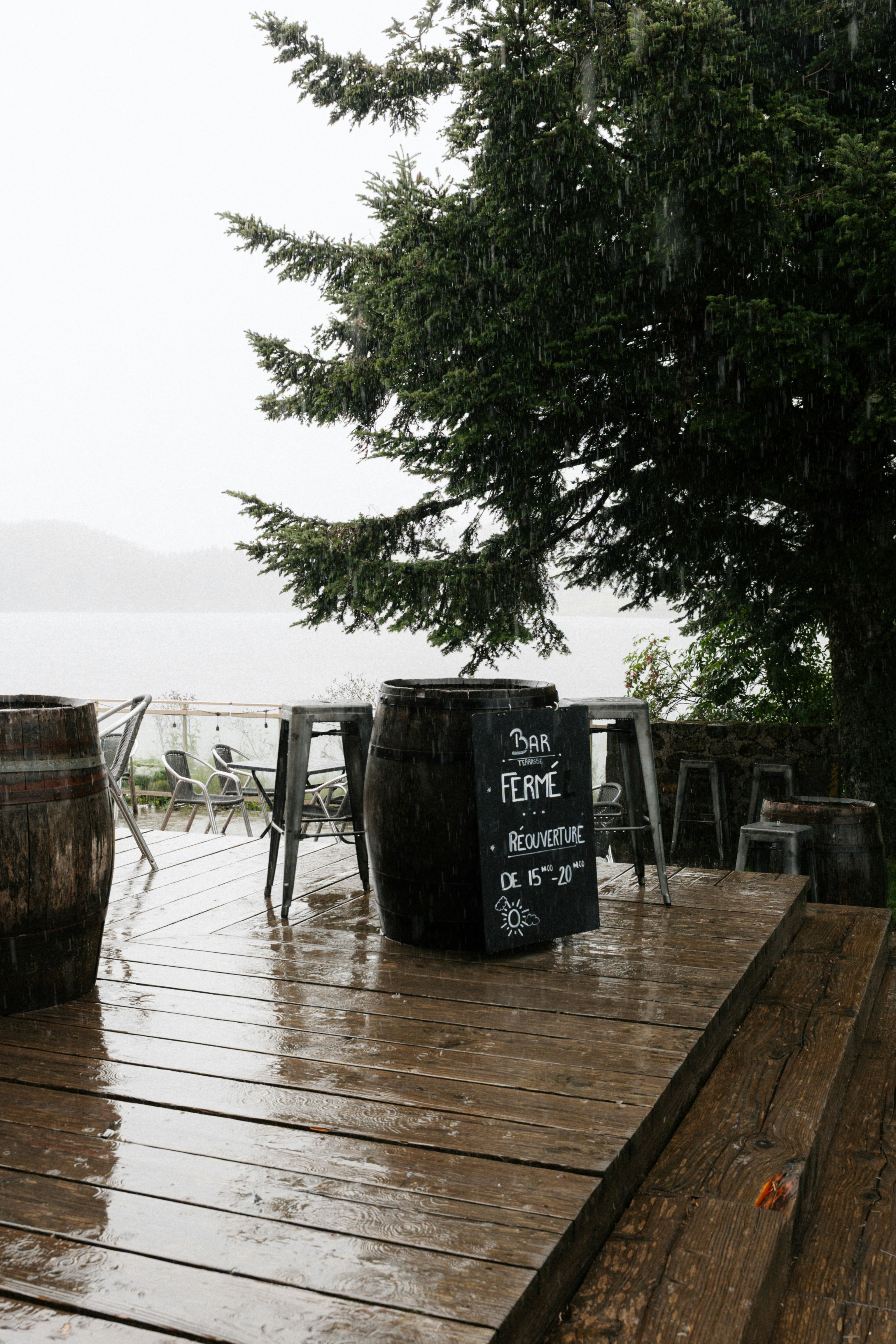 Rainy day on a wooden deck with barrels and barrels. photo – Free Rainy ...