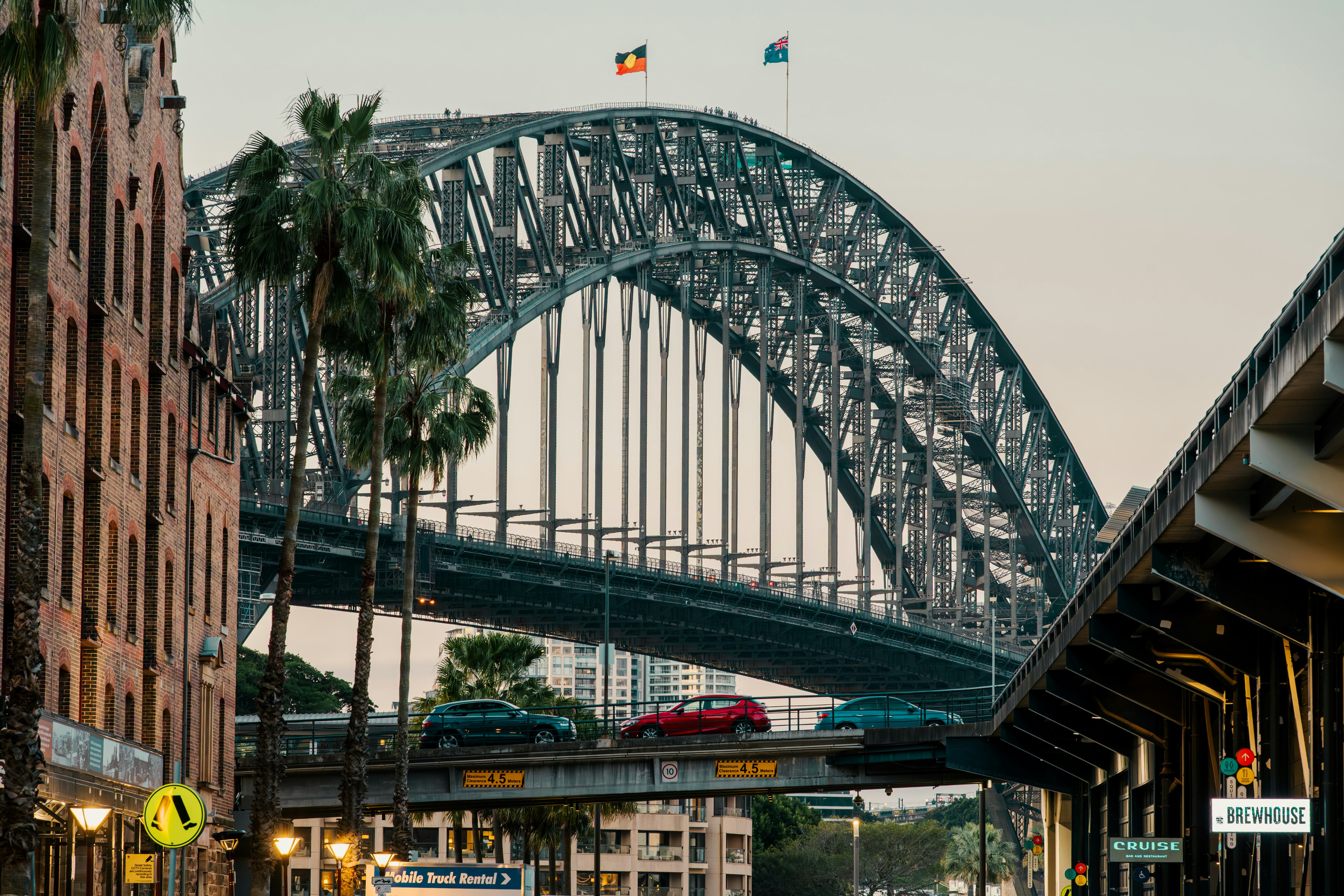 Sydney harbour bridge with cars crossing at dusk