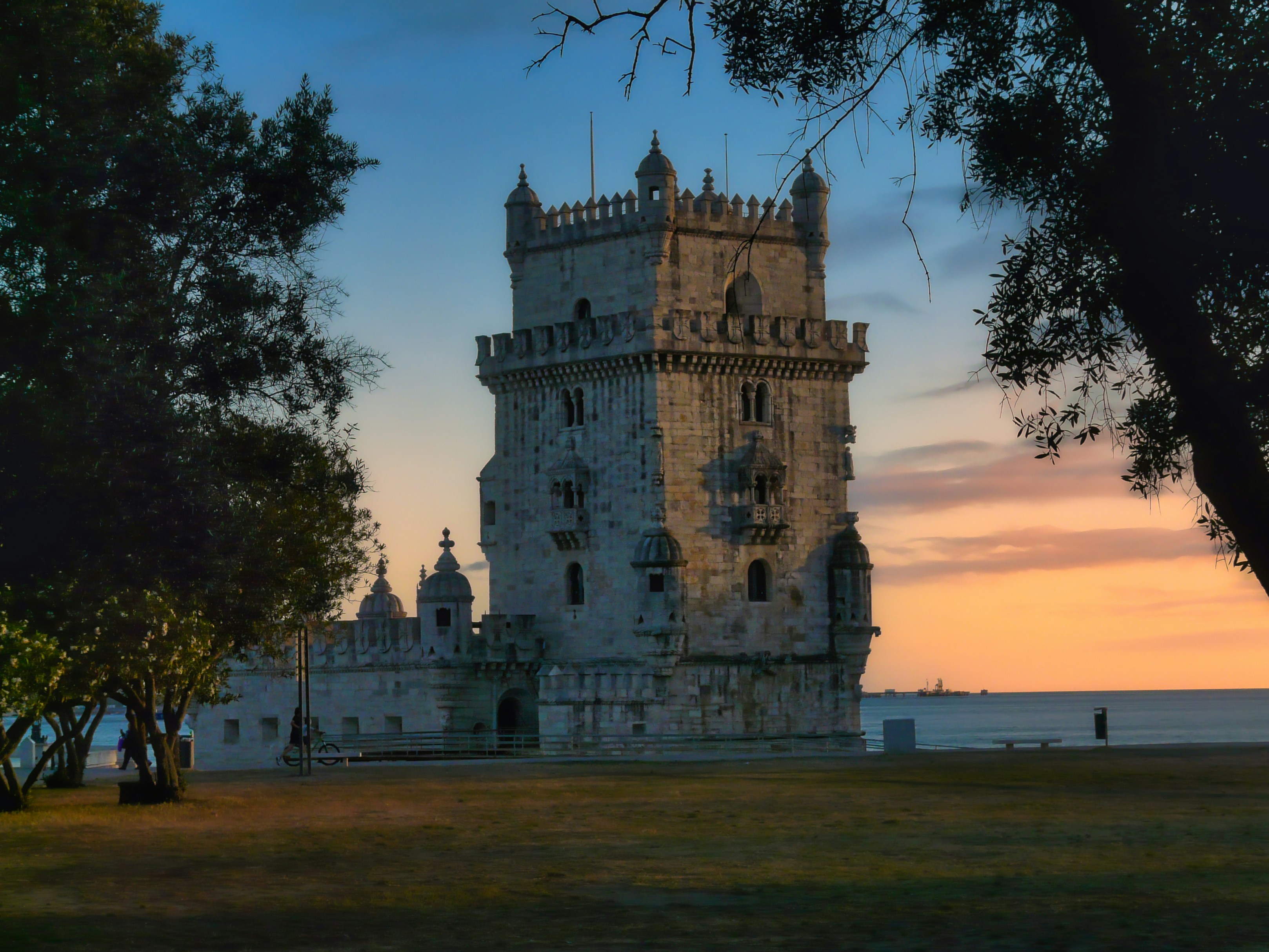Belem Tower | Belem tower at sunset with trees framing view
