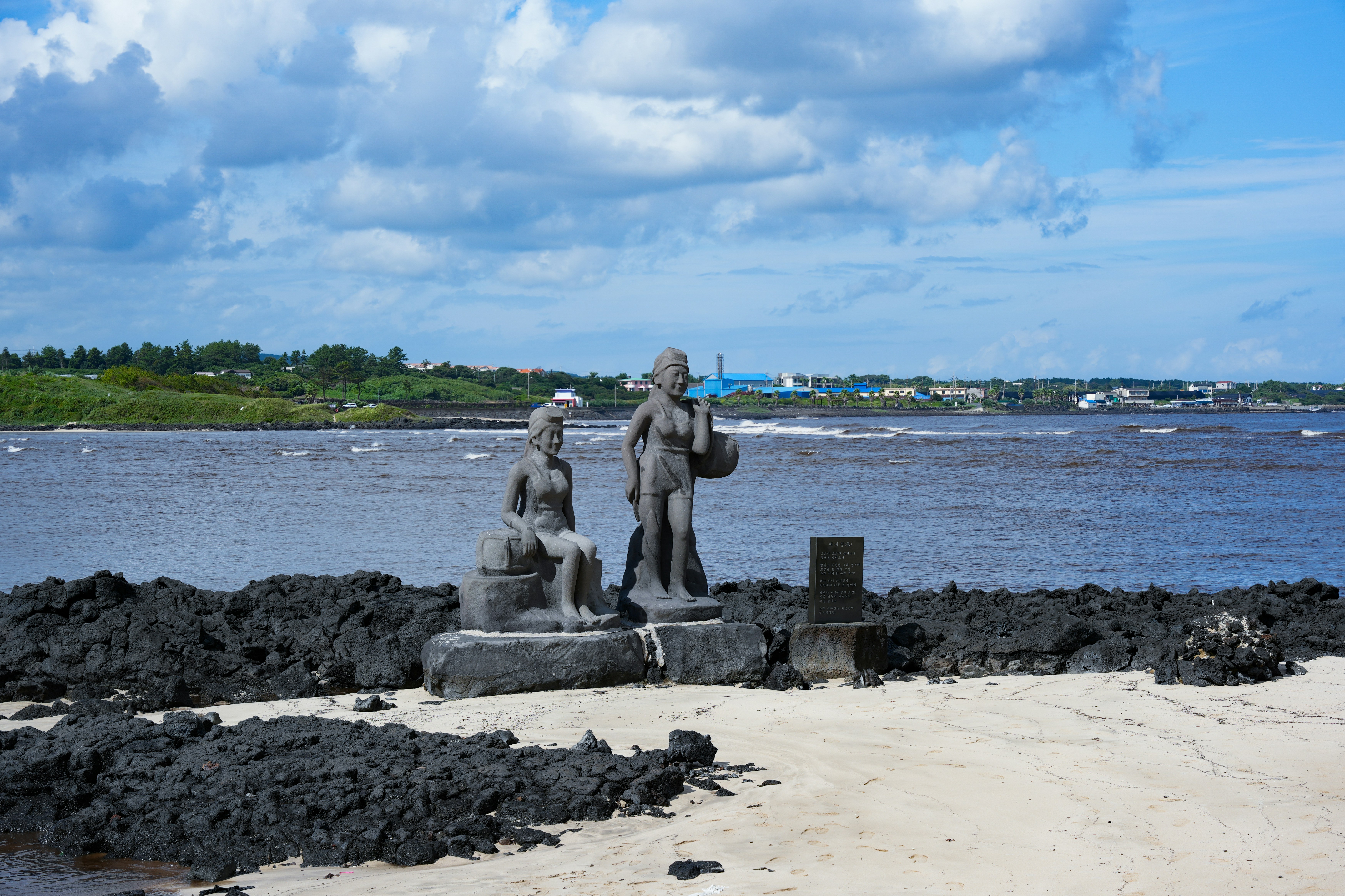 Stone Sentinels on a Lava-Strip Shore