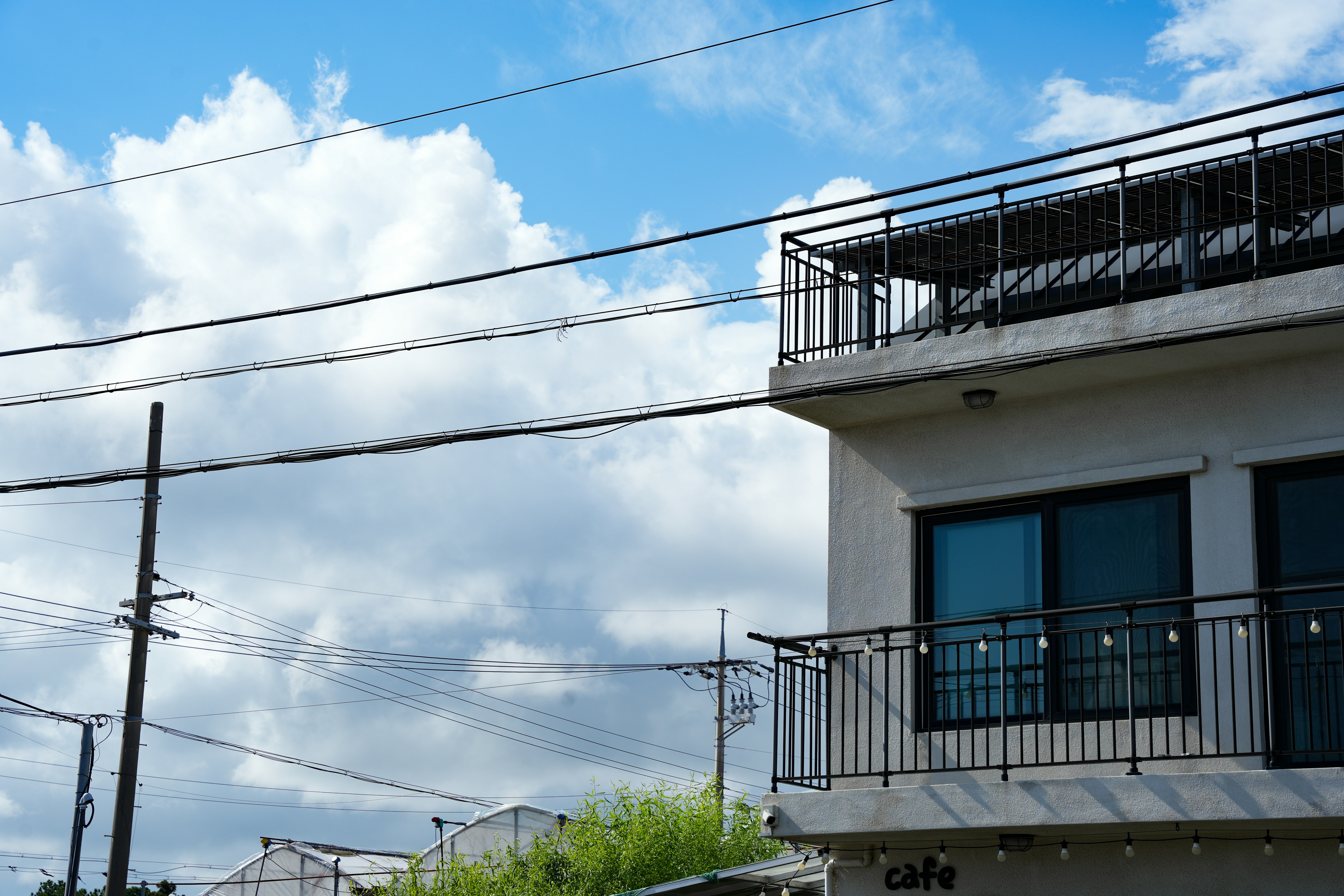 Modern building with balconies under a cloudy sky