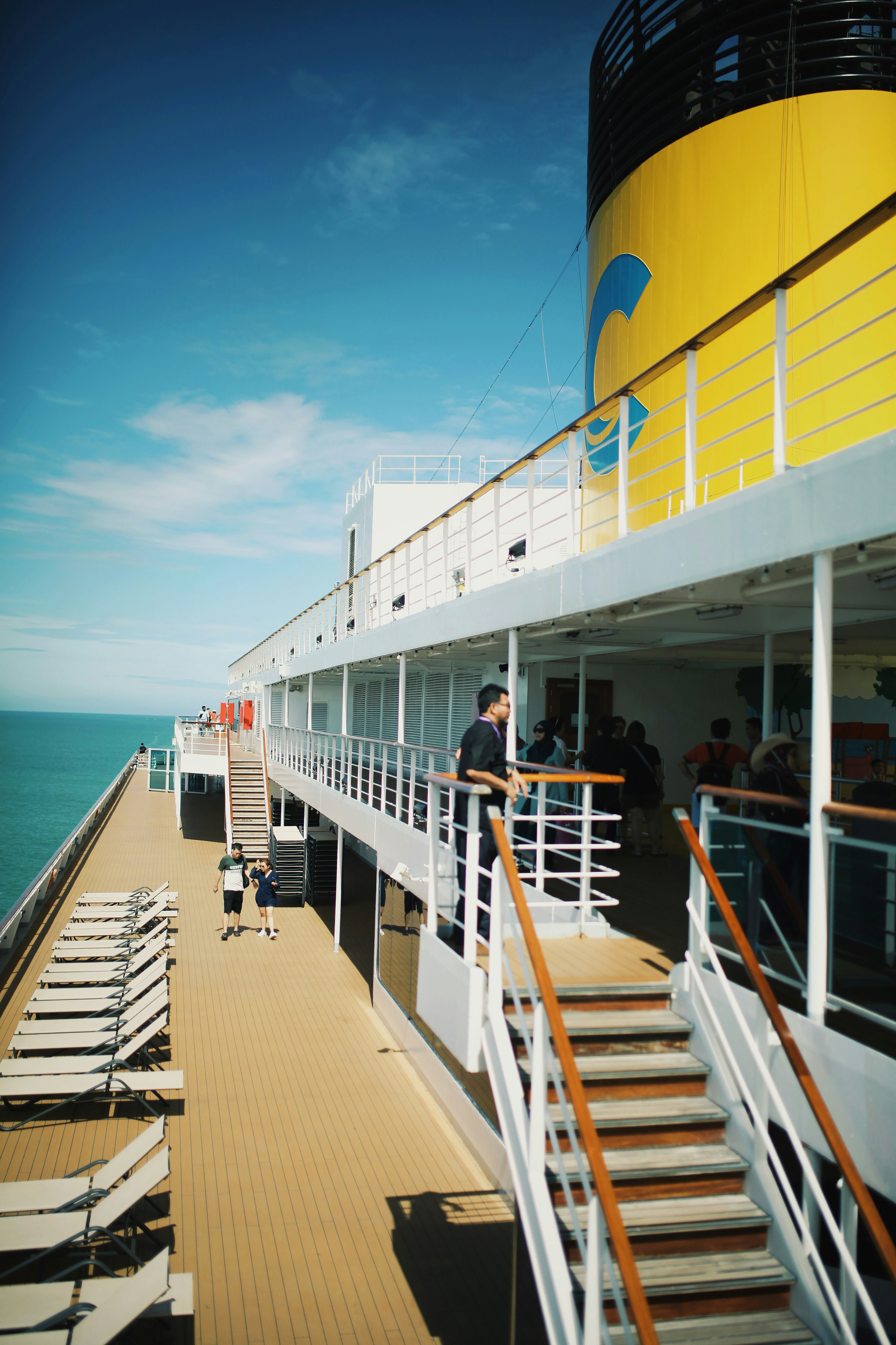 Costa Serena cruise ship | Deck of a cruise ship with people and ocean view.