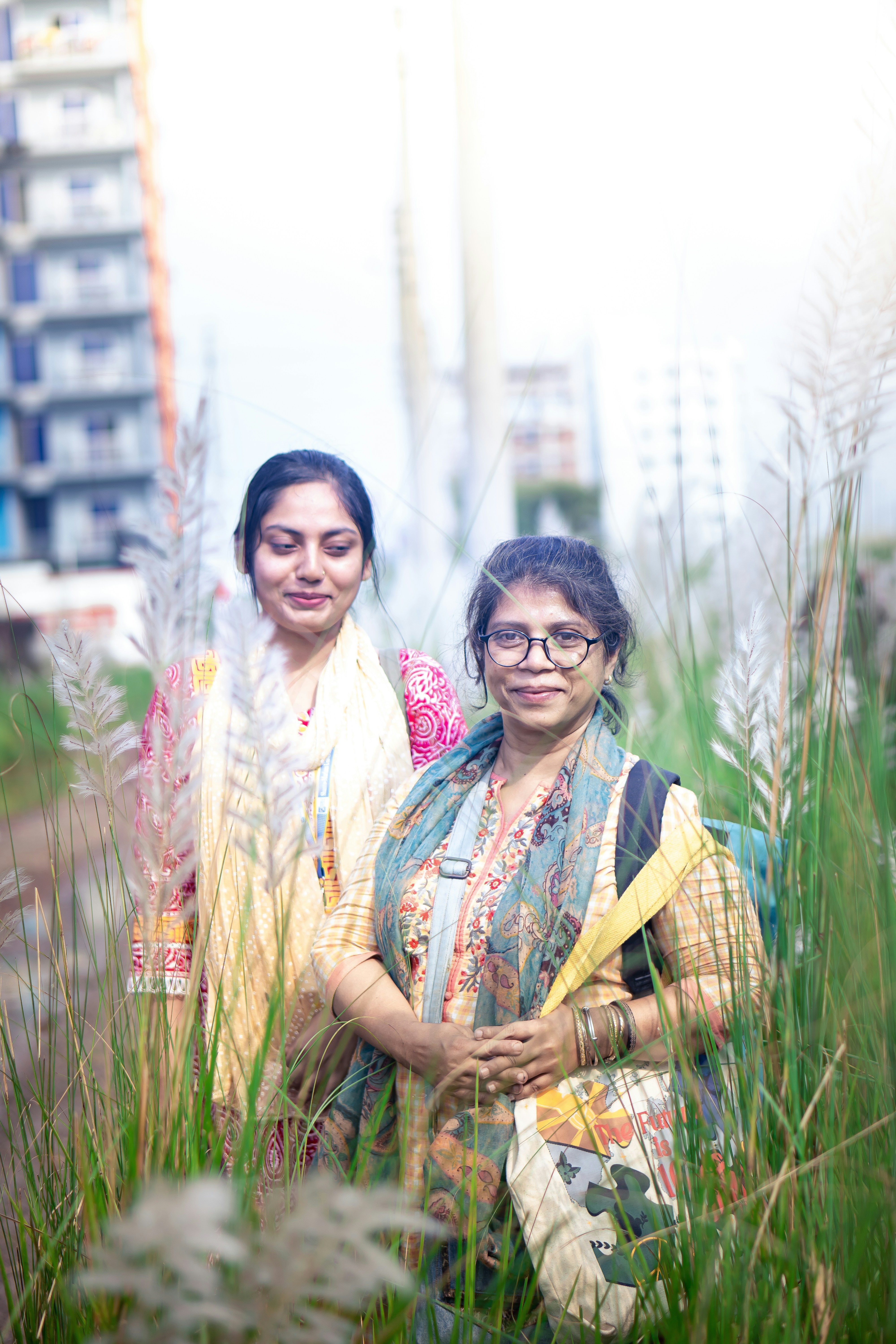 Portrait in the Grasses: Friends Amid Urban Light
