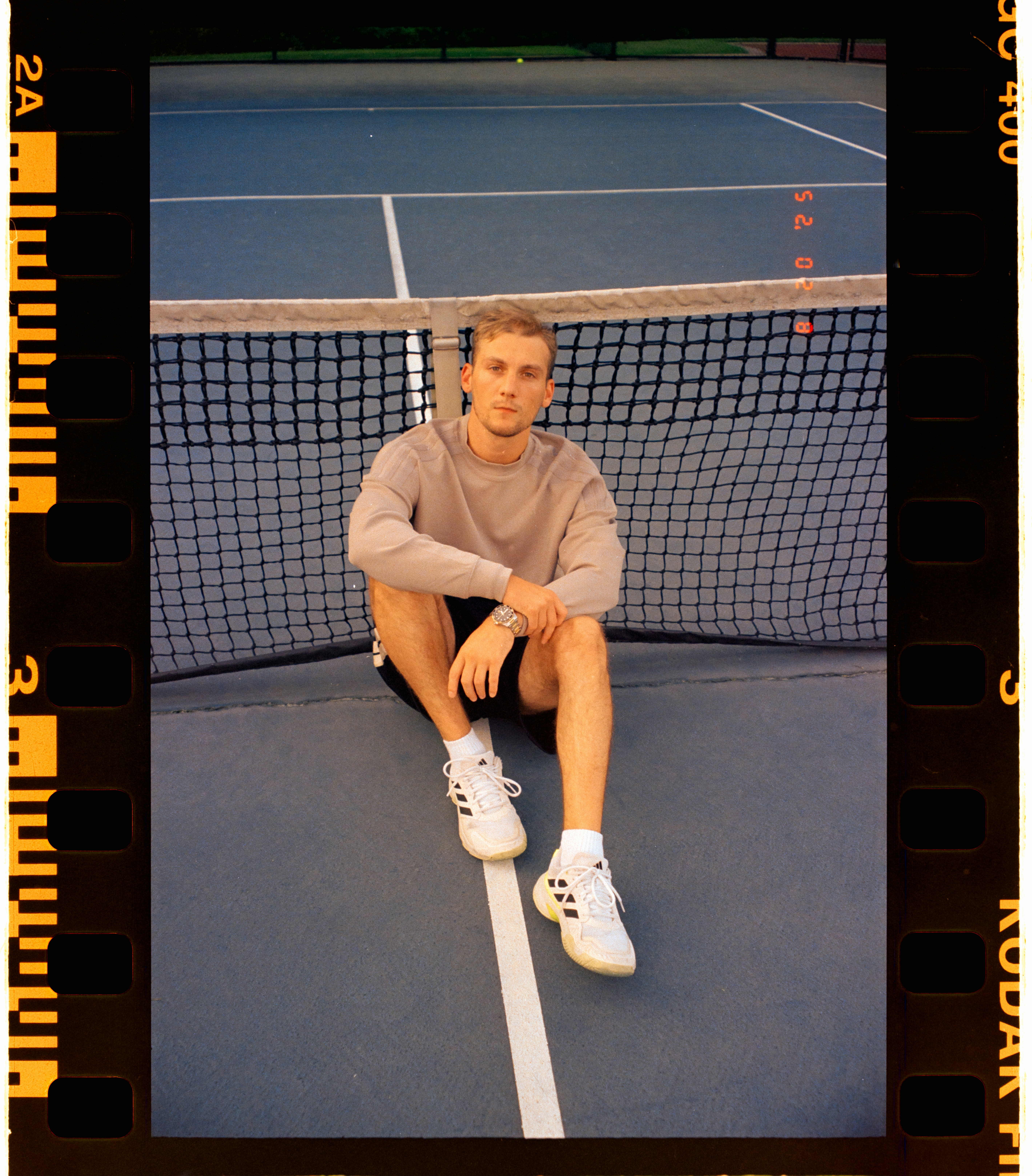 Still Moments at the Net: a Quiet Portrait on a Blue Tennis Court