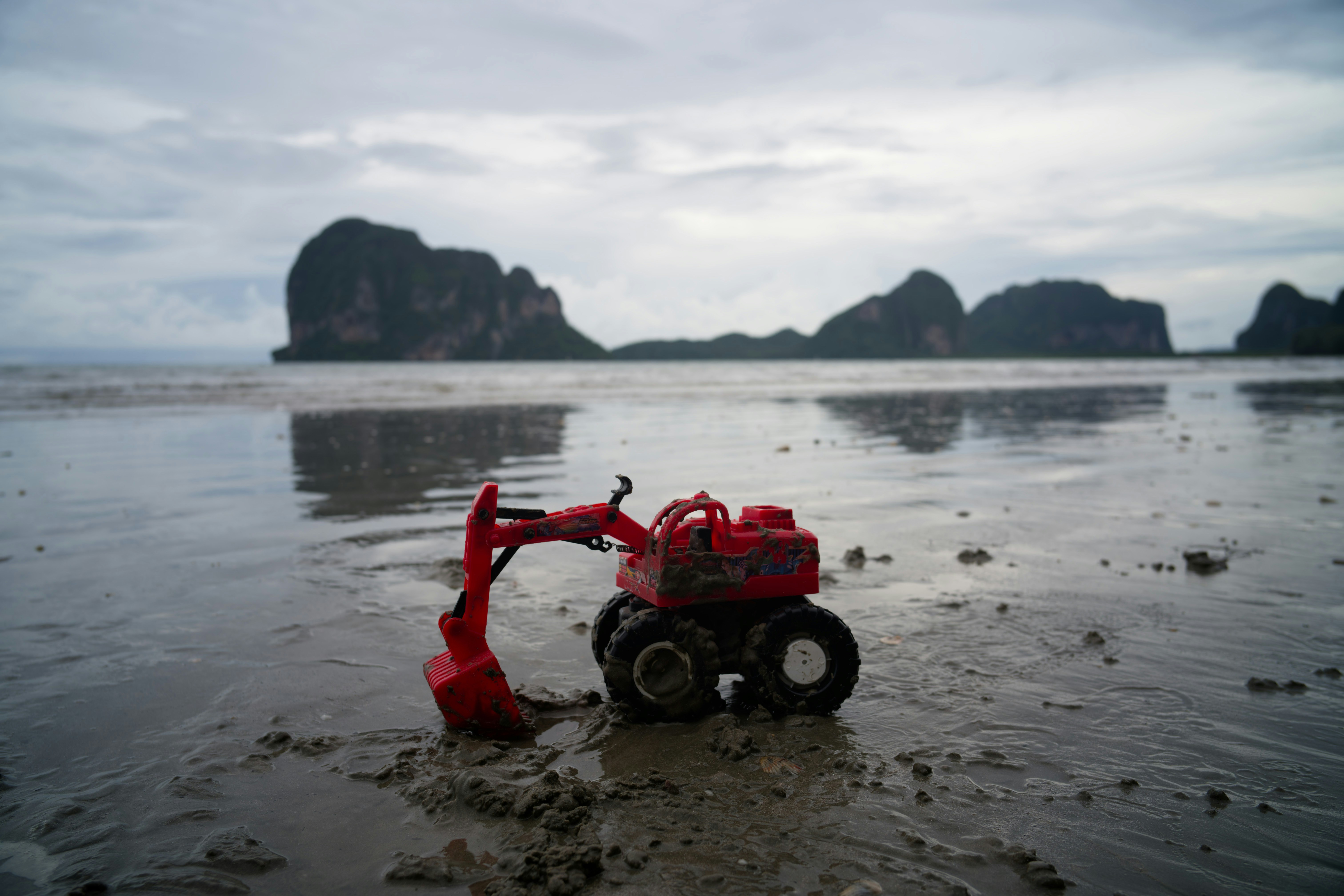 Miniature Excavator Amidst Nature's Grandeur