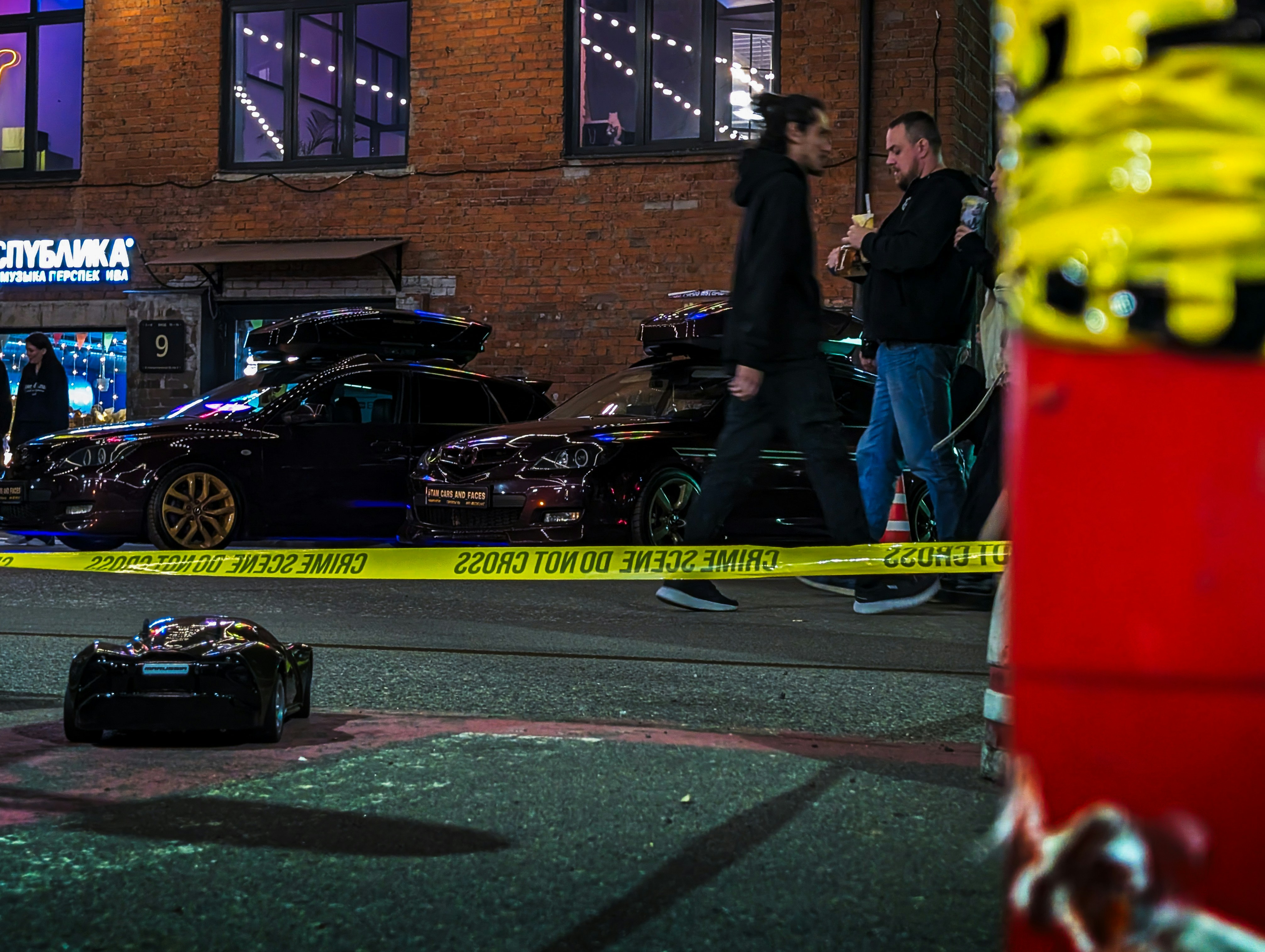 Cars parked on a city street at night