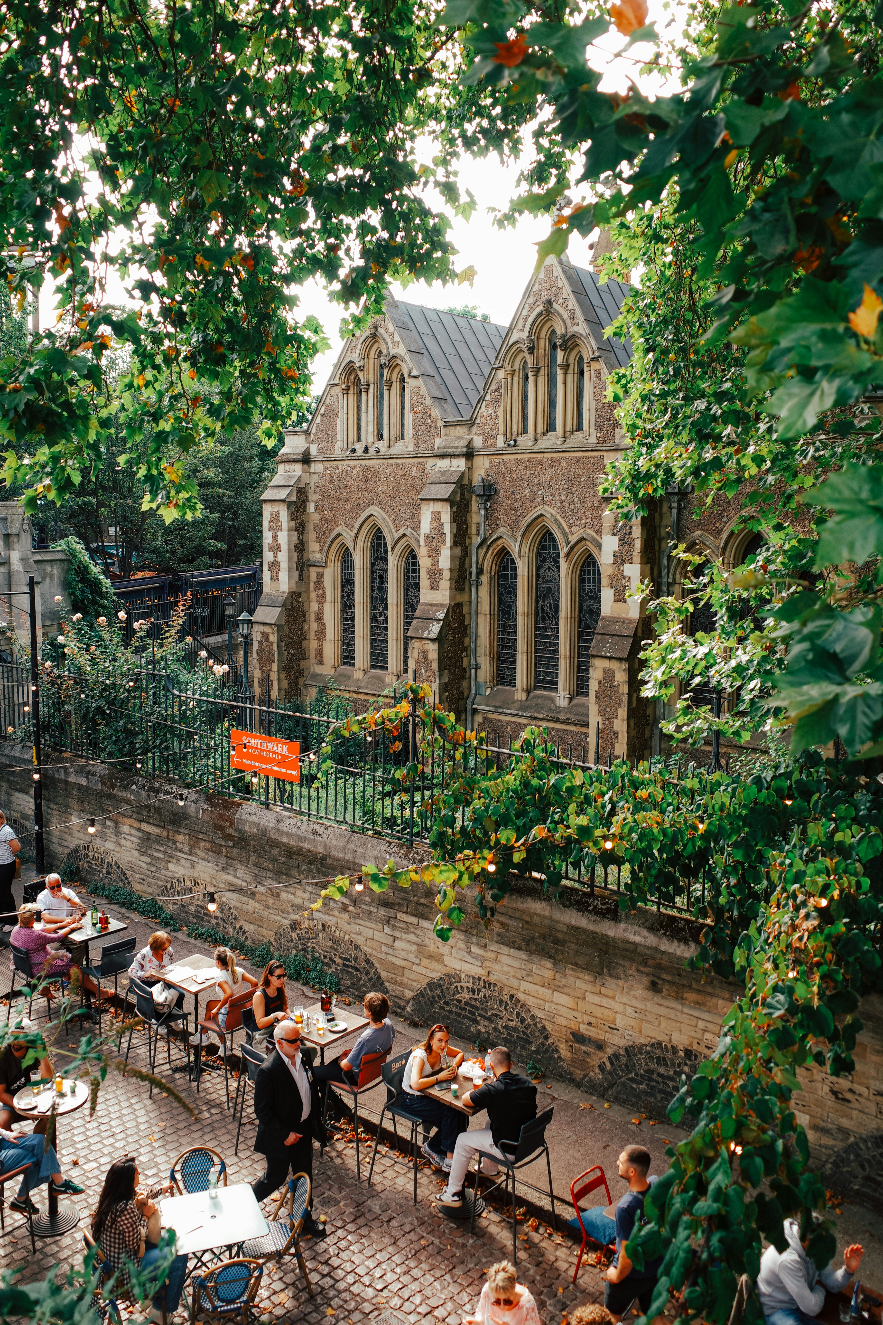 Cobbled Courtyard Café Under Gothic Arches