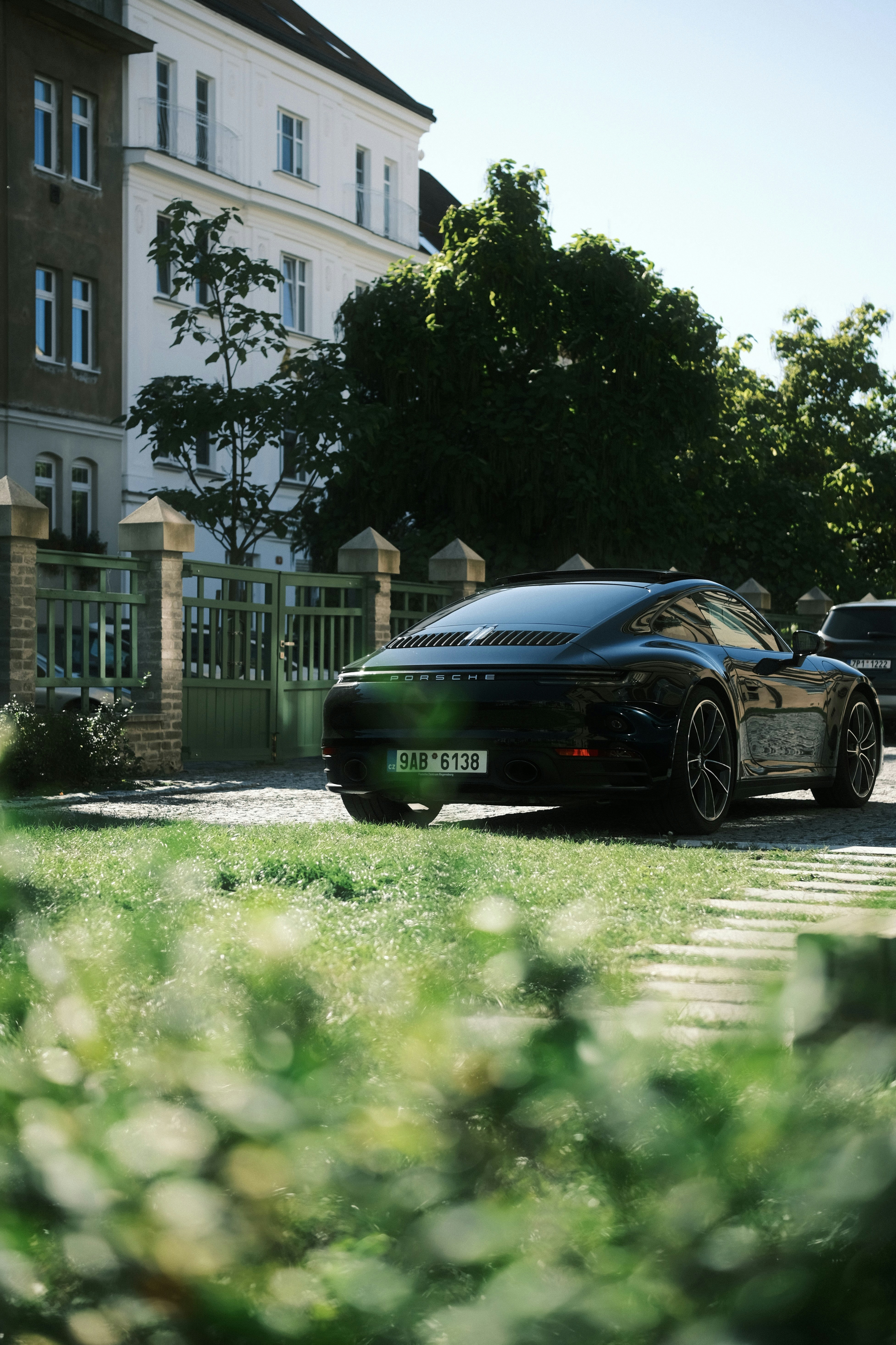 Porsche 911 Carrera S / 4S | Black porsche parked on a sunny street