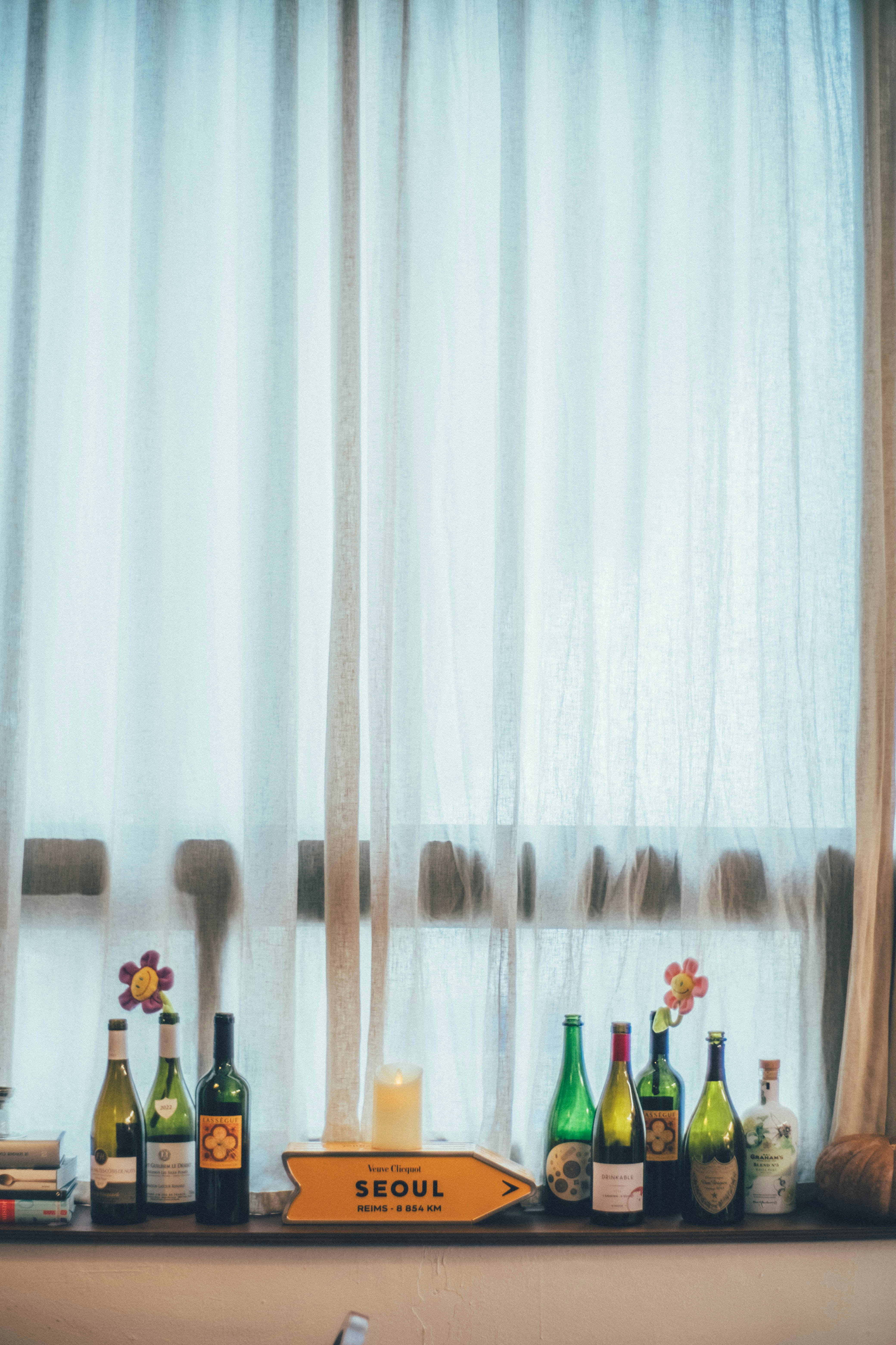 Bottles and decorations on a windowsill