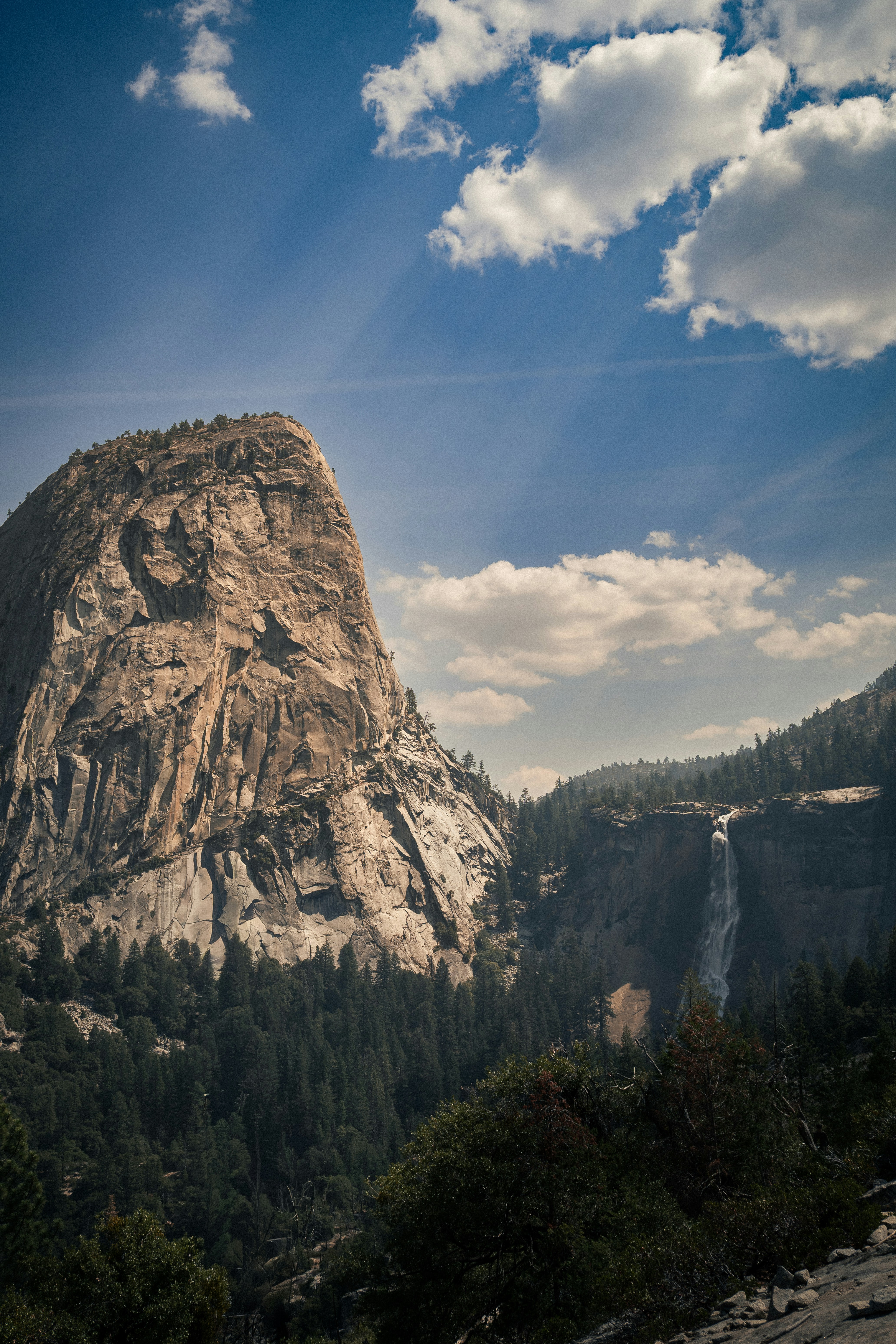 Liberty Cap and Nevada Falls in Yosemite | Massive granite dome with waterfall and forest