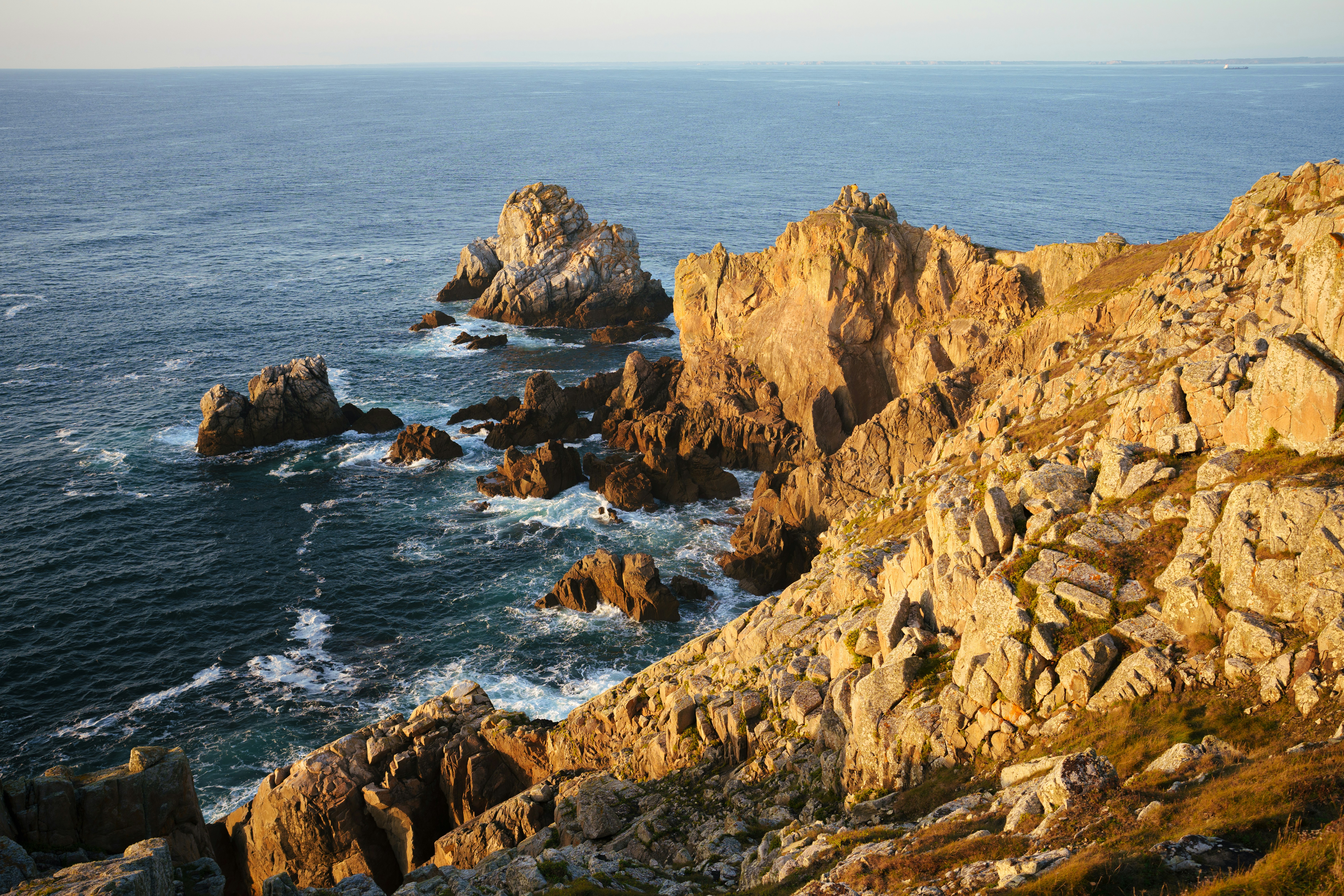 Whispers of the Tides: A Rocky Coastline's Embrace