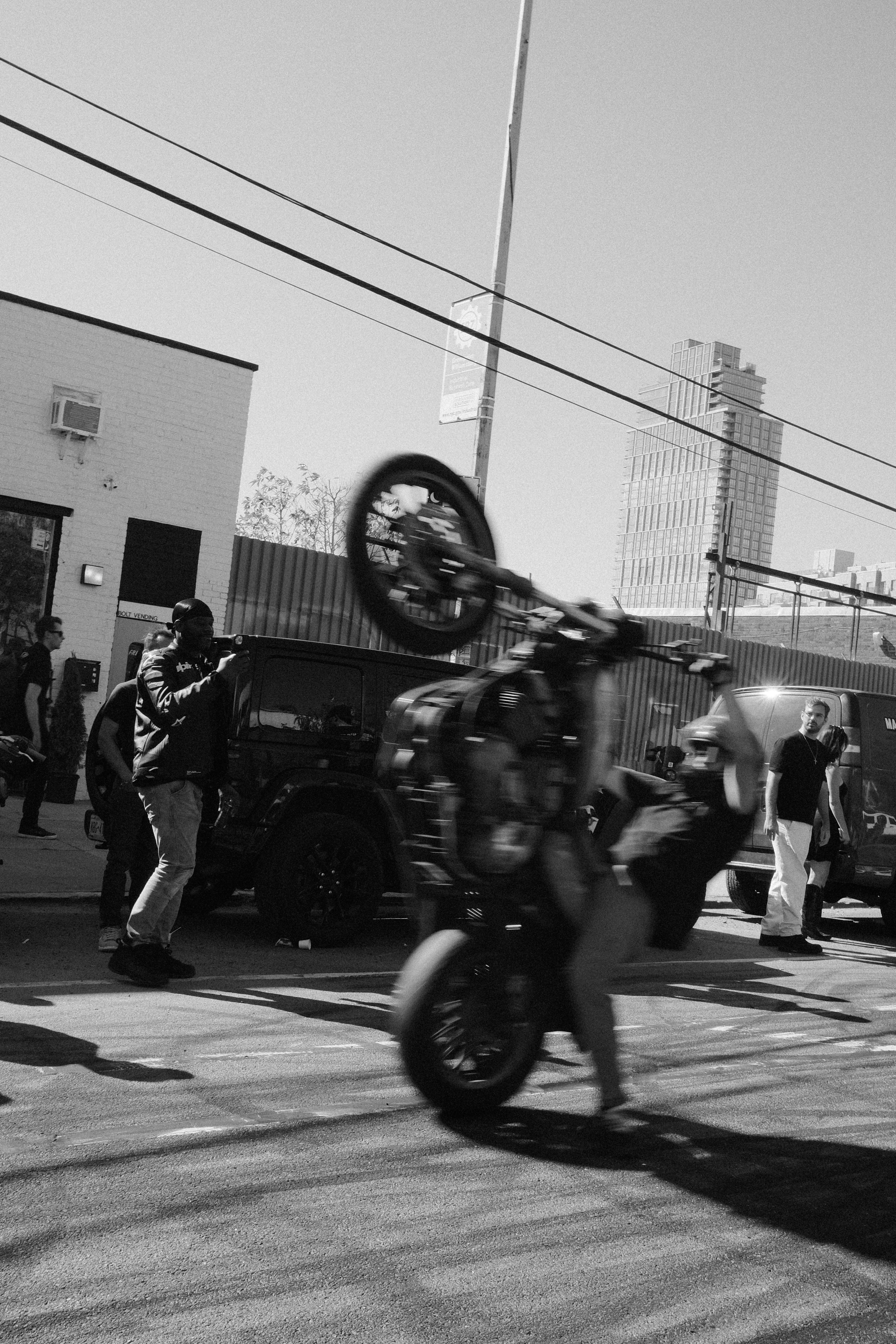 Wheelie in the Concrete Jungle: A Monochrome Street Stunt