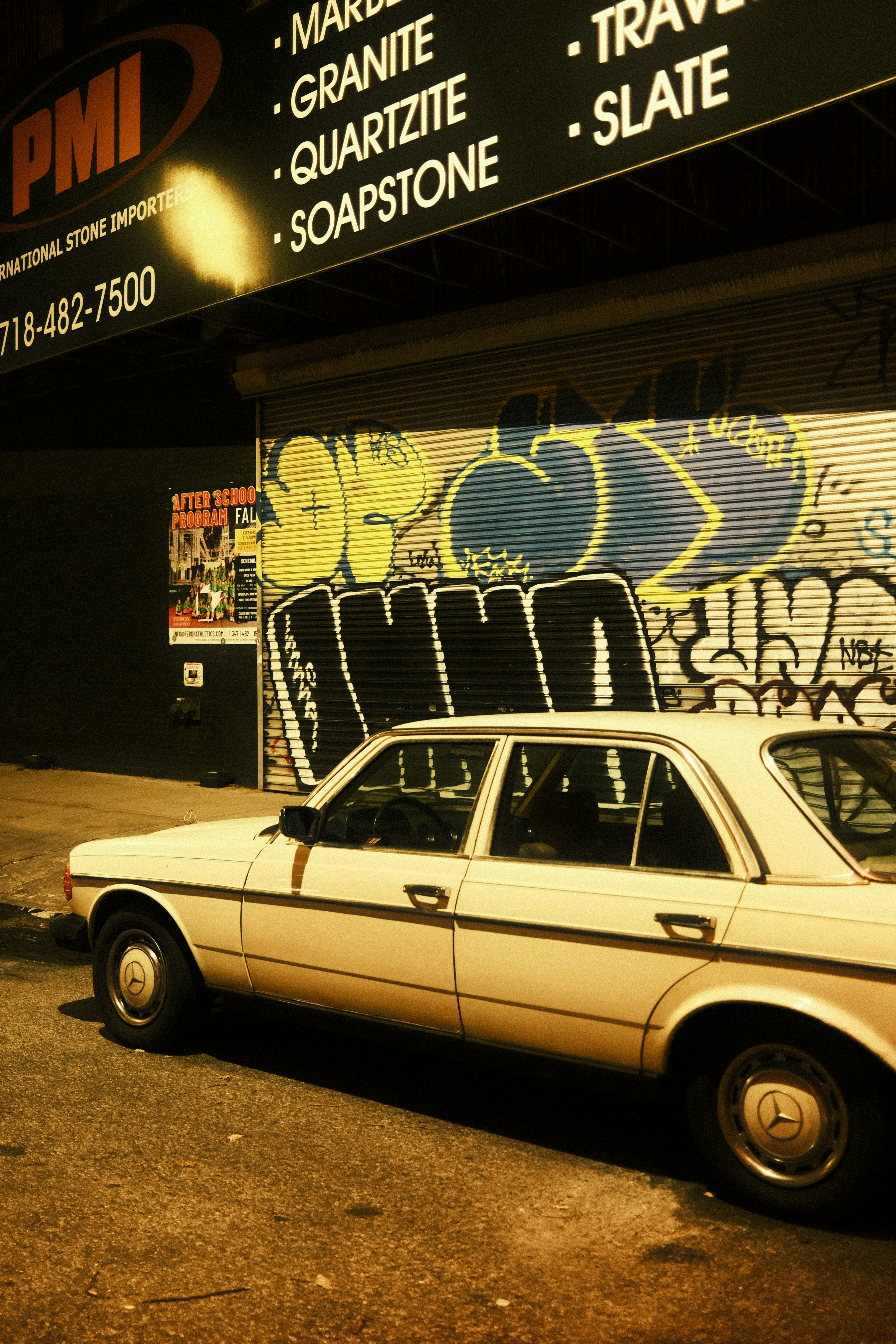 Urban Echoes: A Classic Car Amidst Graffiti