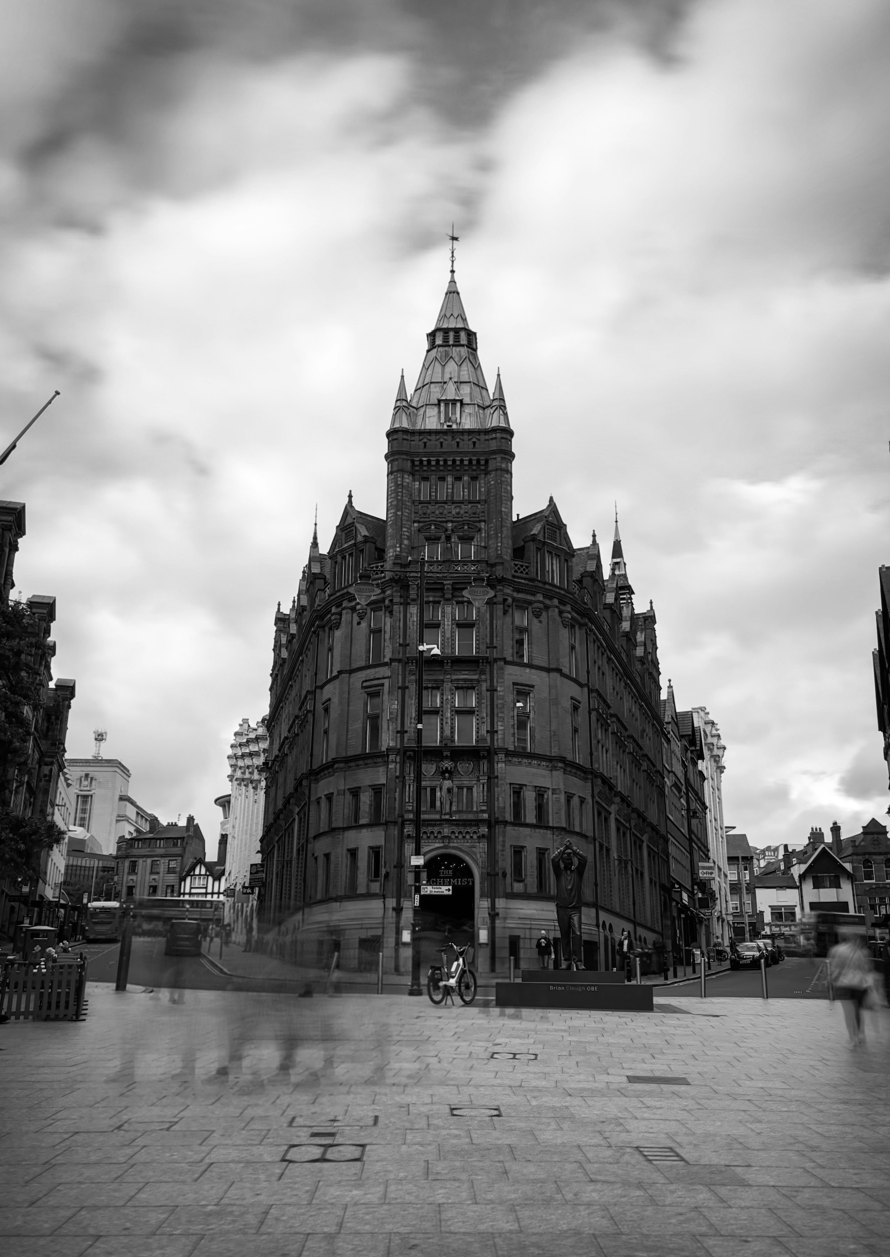 Gothic Summit: The Central Tower Reigns Over a Blurred City Square