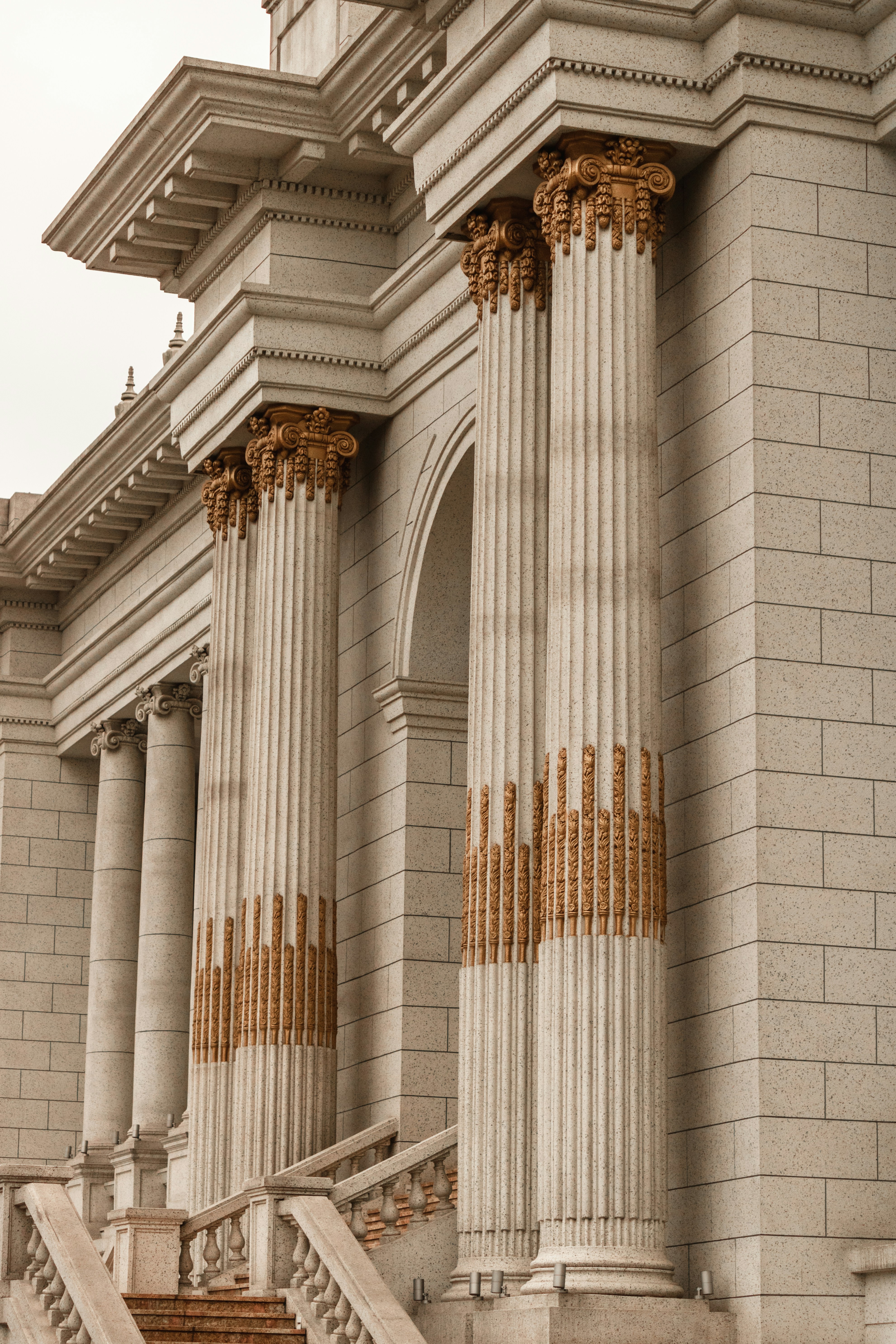 Sepia Neoclassicism: Gold-Tipped Columns Framing a Grand Arch