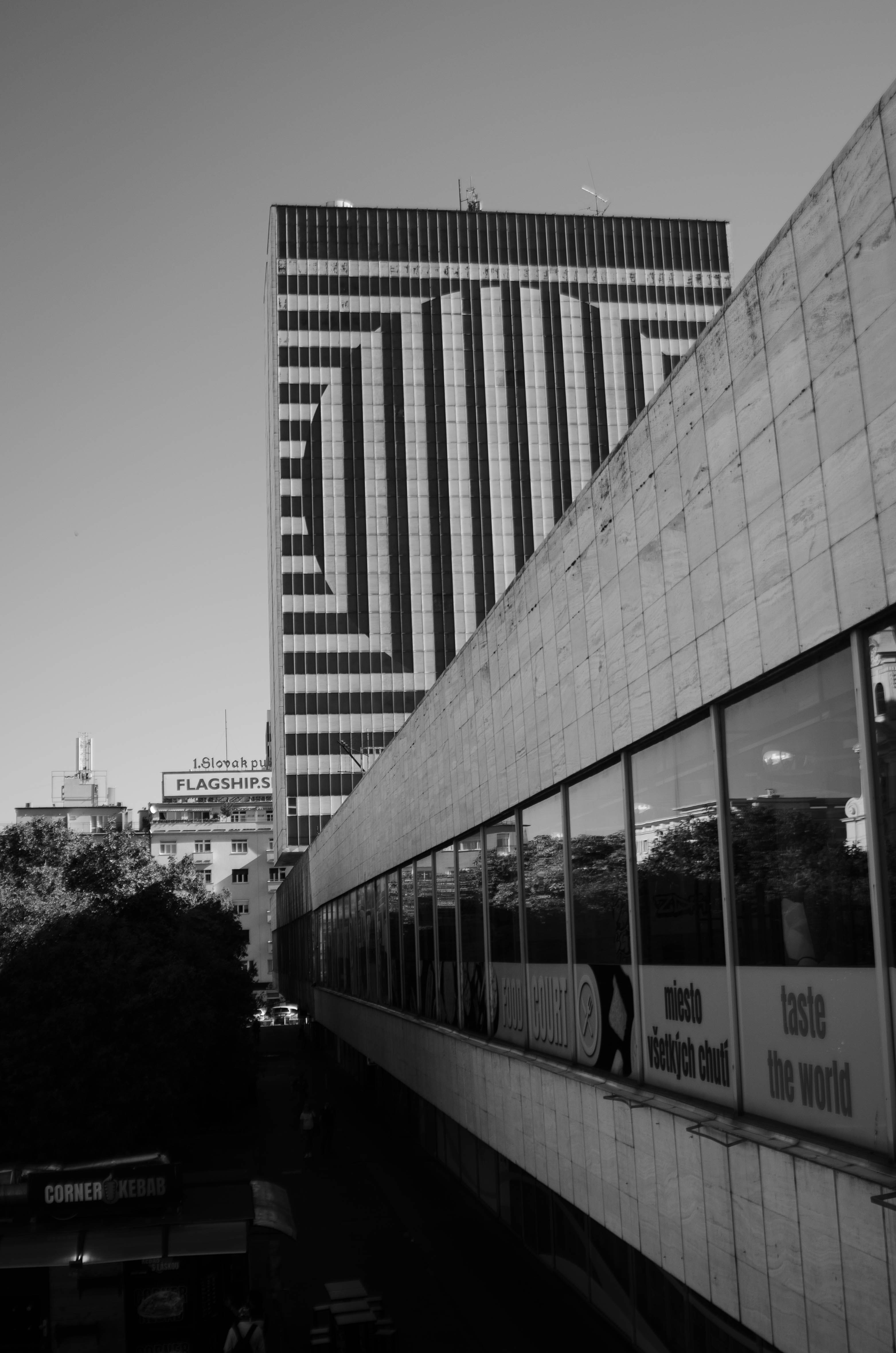 Modern buildings with geometric patterns and reflections.
