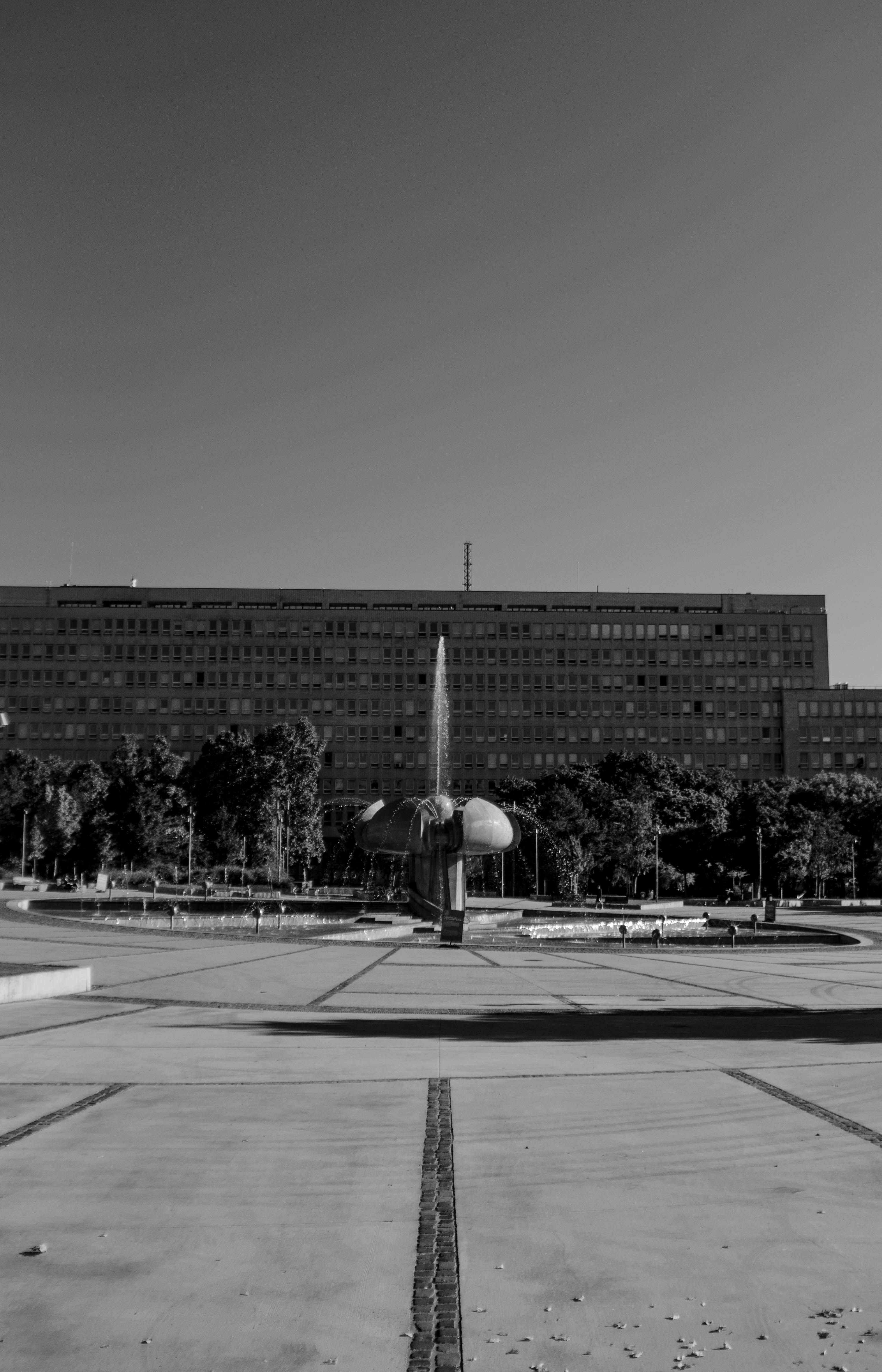 Fountain in front of a large building