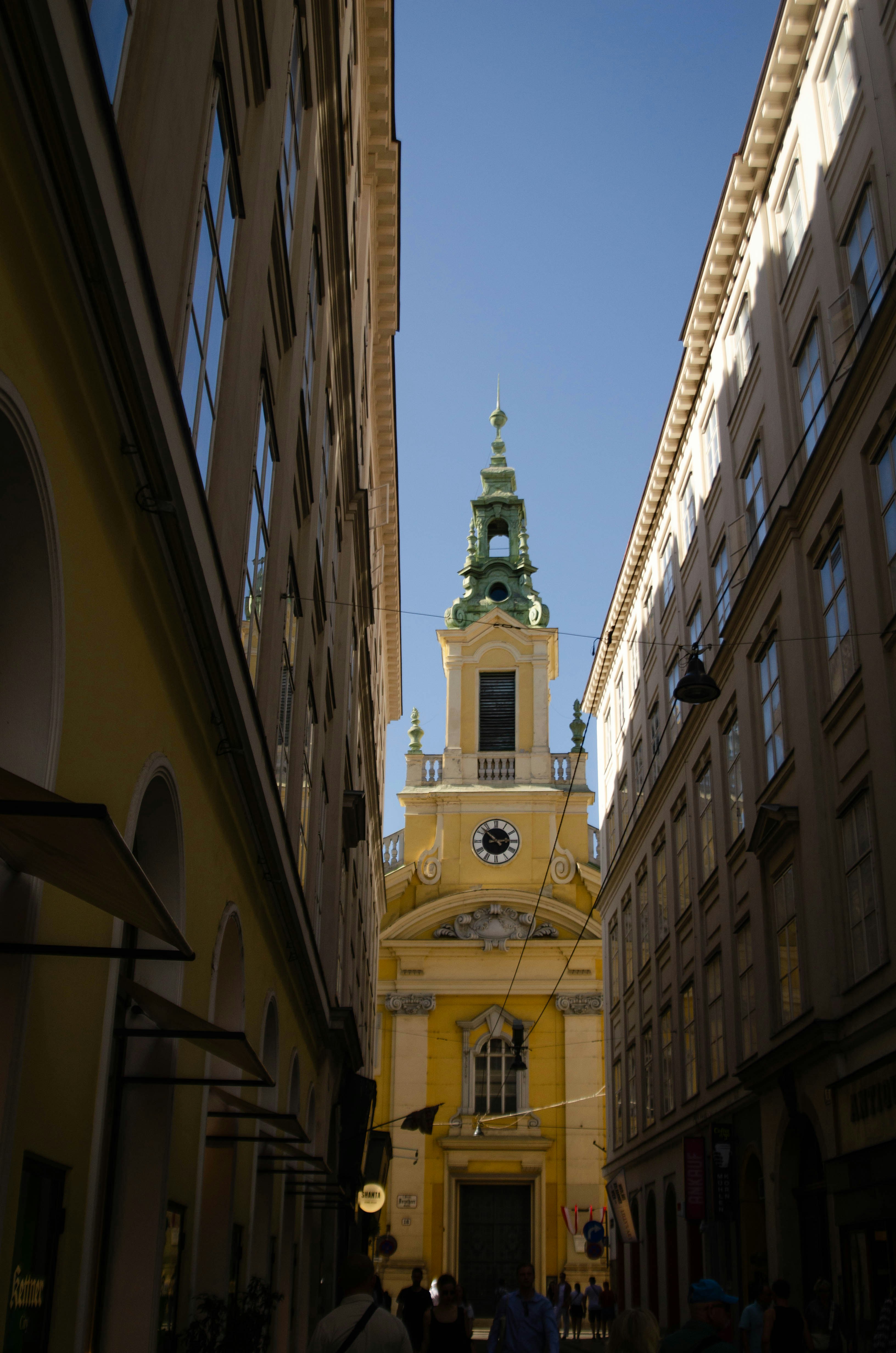 Golden Spire Amidst Urban Shadows