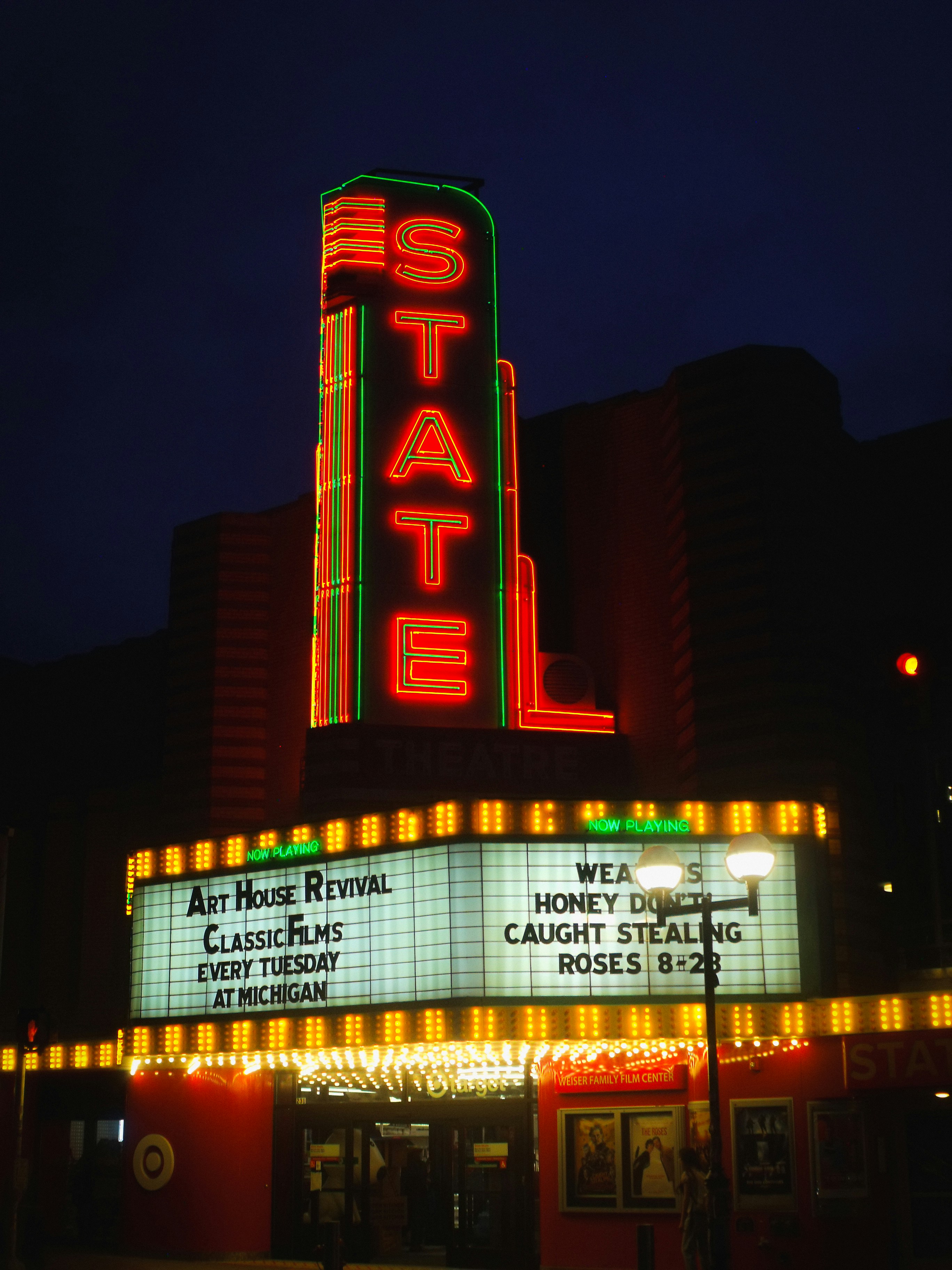 Estate theater marquee at night with neon lights