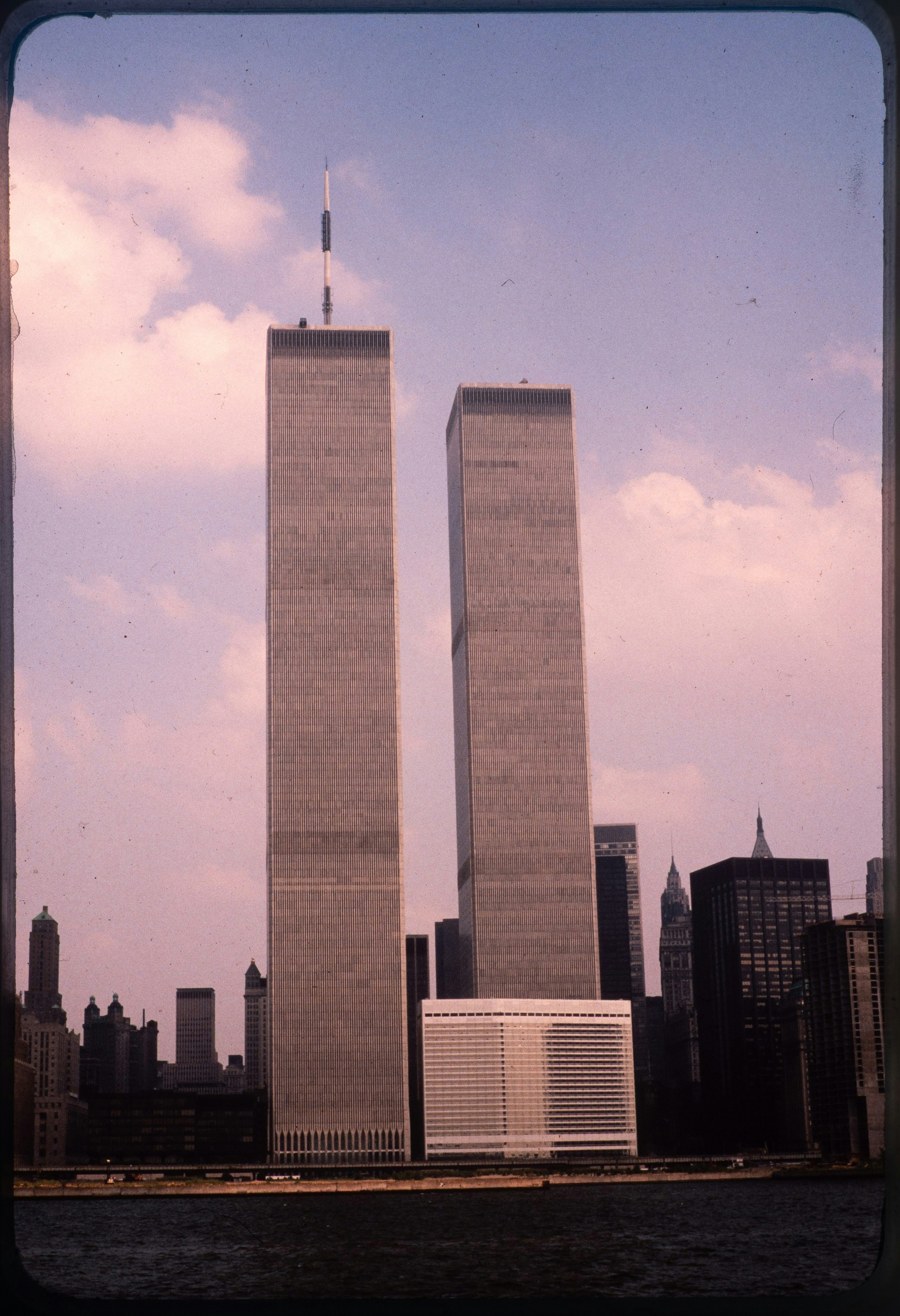 The twin towers stand tall against a cloudy sky. photo – Free ...