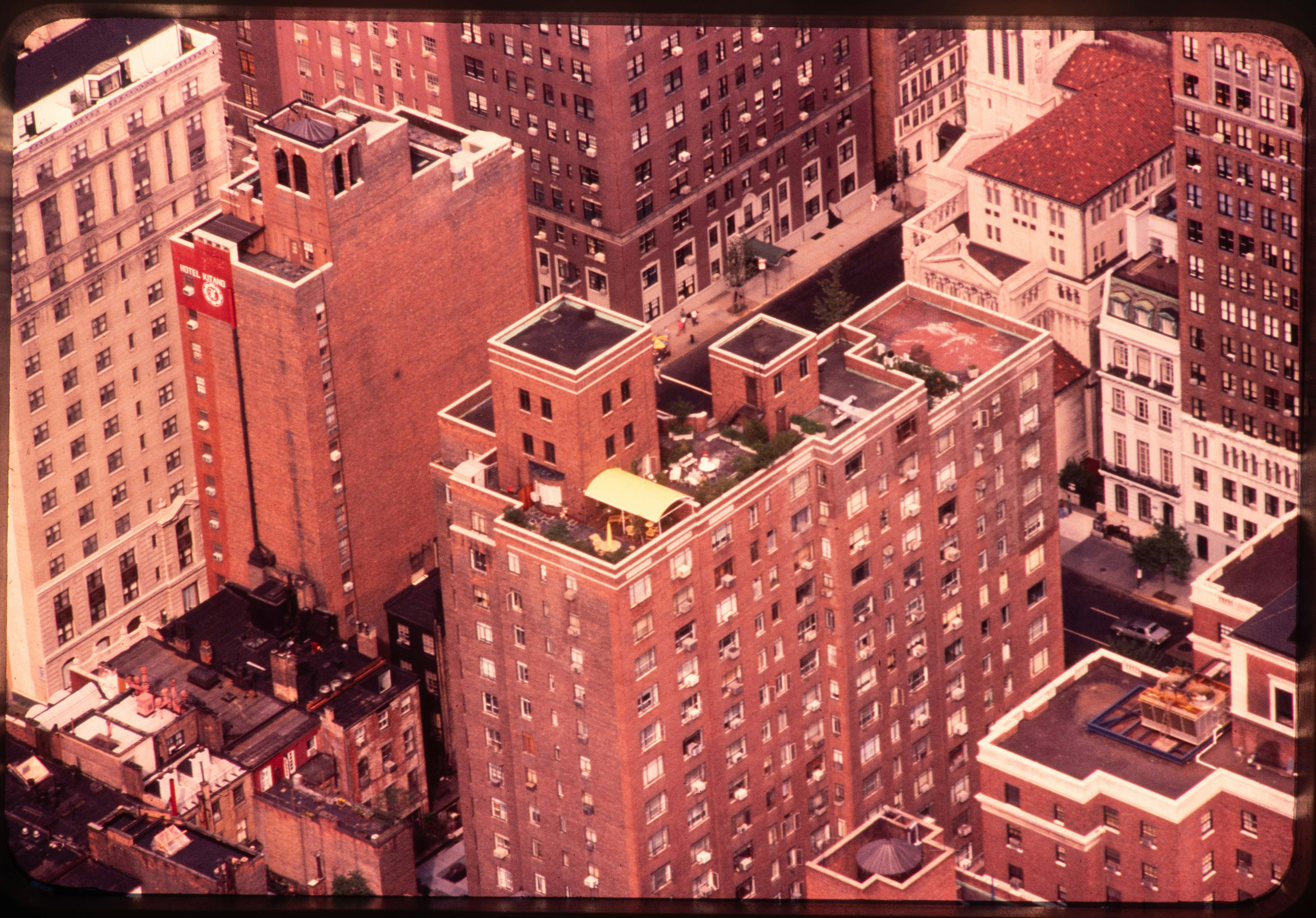 OLYMPUS DIGITAL CAMERA | Aerial view of new york city buildings and rooftops.
