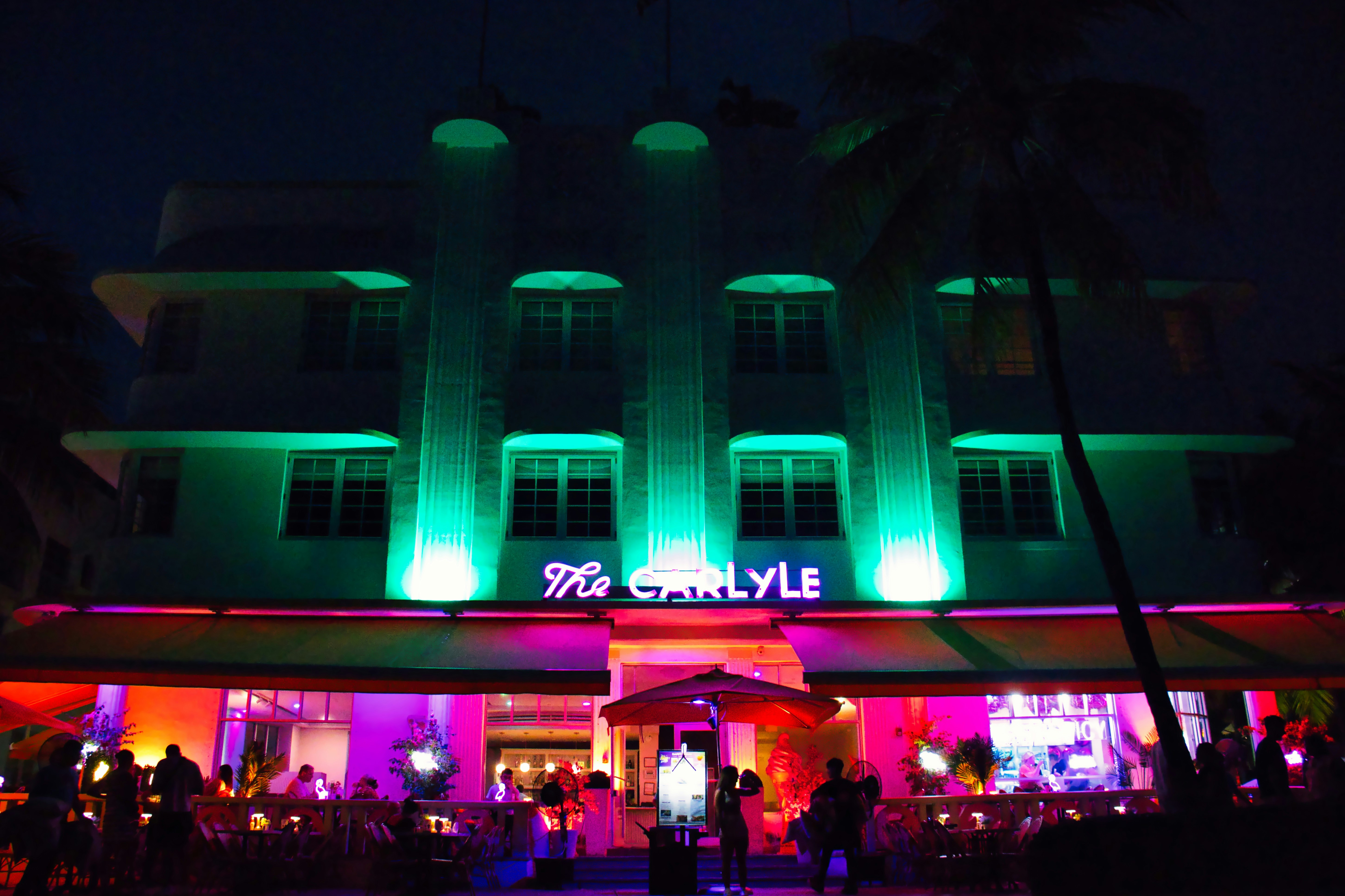 Neon Oasis: The Carlyle's Nighttime Glow