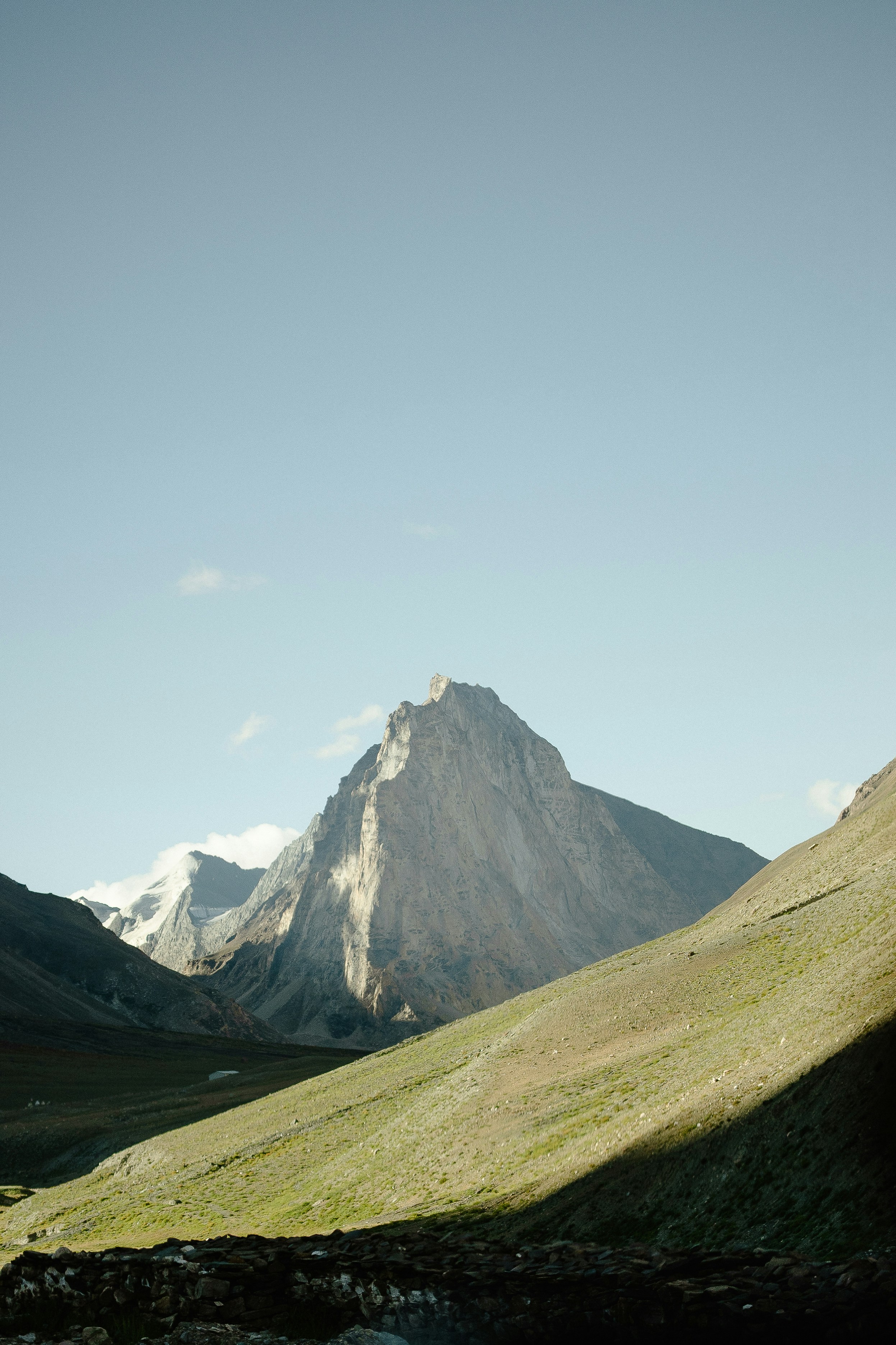 The Sentinel Peak: Sunlit Ridge Guarding a Quiet Alpine Valley