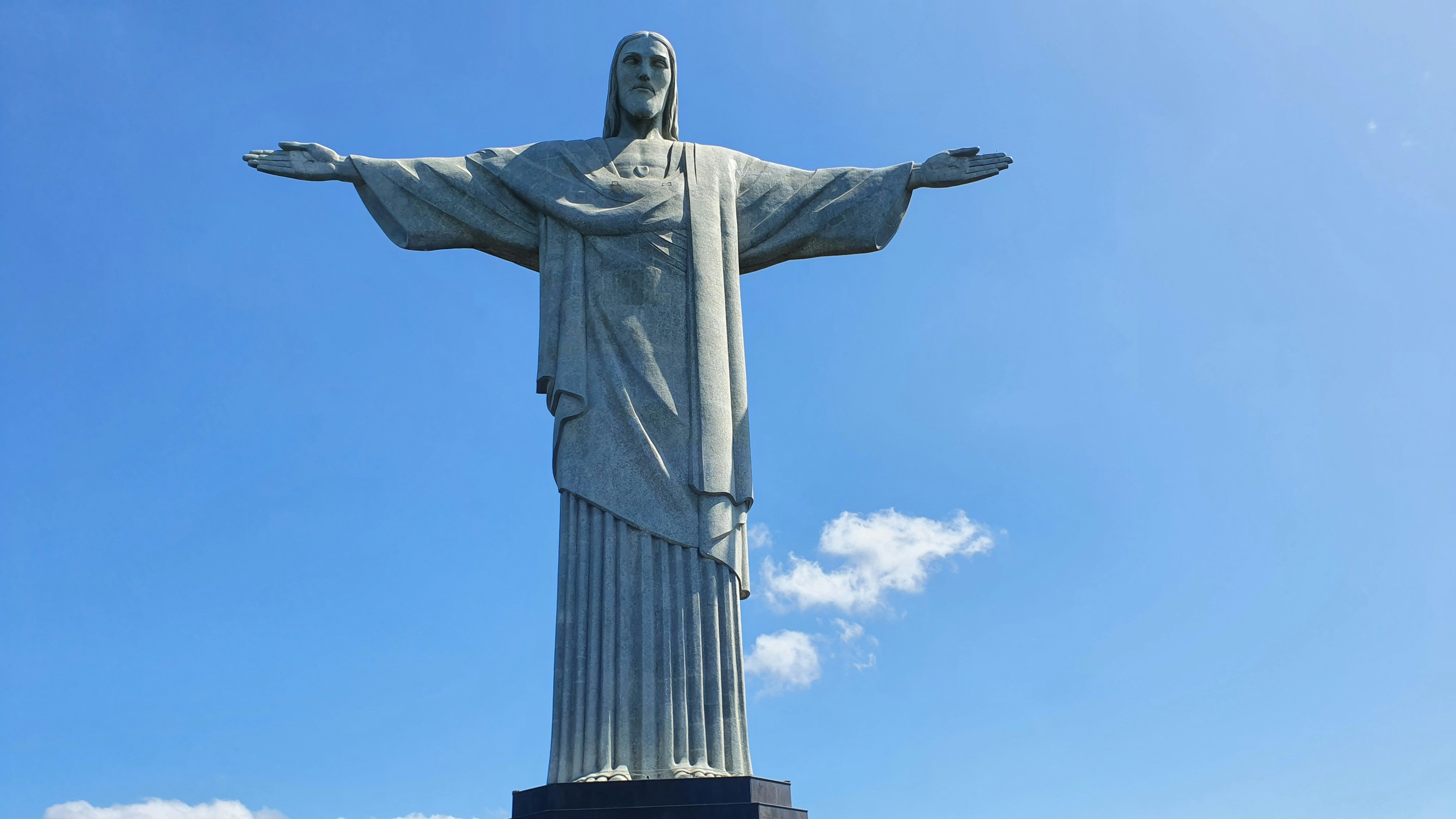 Christ the redeemer statue against a blue sky