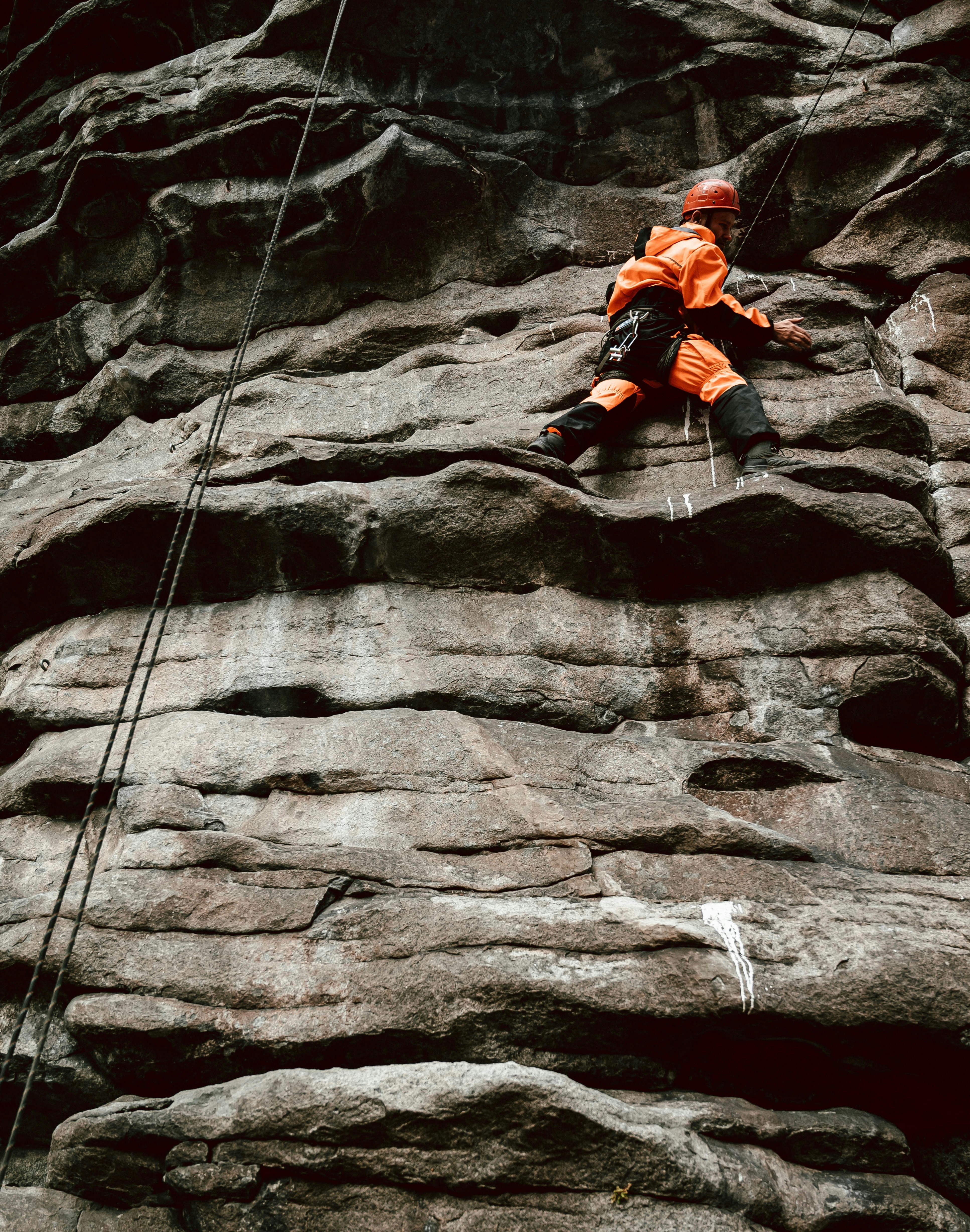 Orange-clad Ascent: Tracing a Line Across Weathered Granite