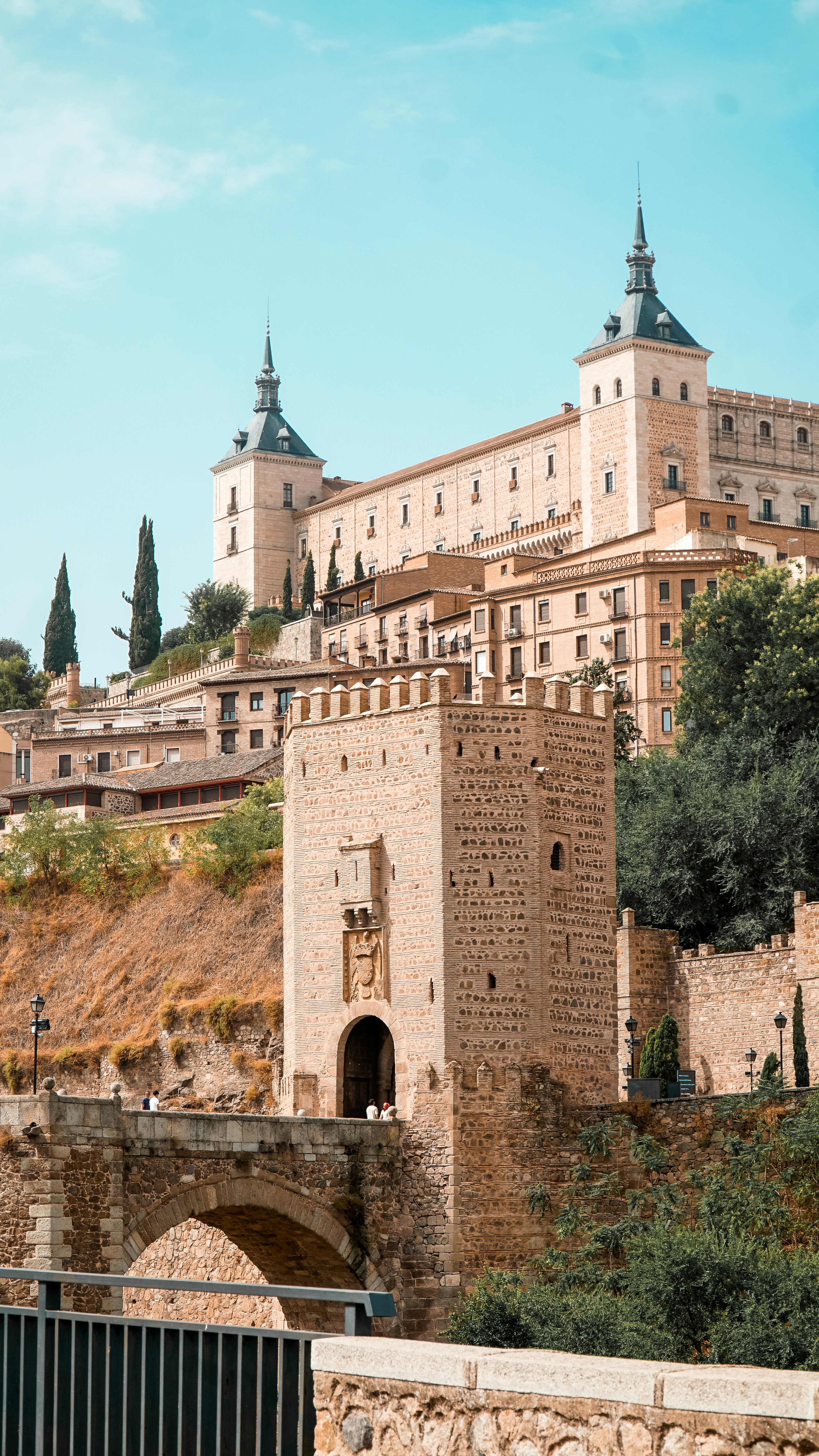Historic stone bridge and tower leading to castle.