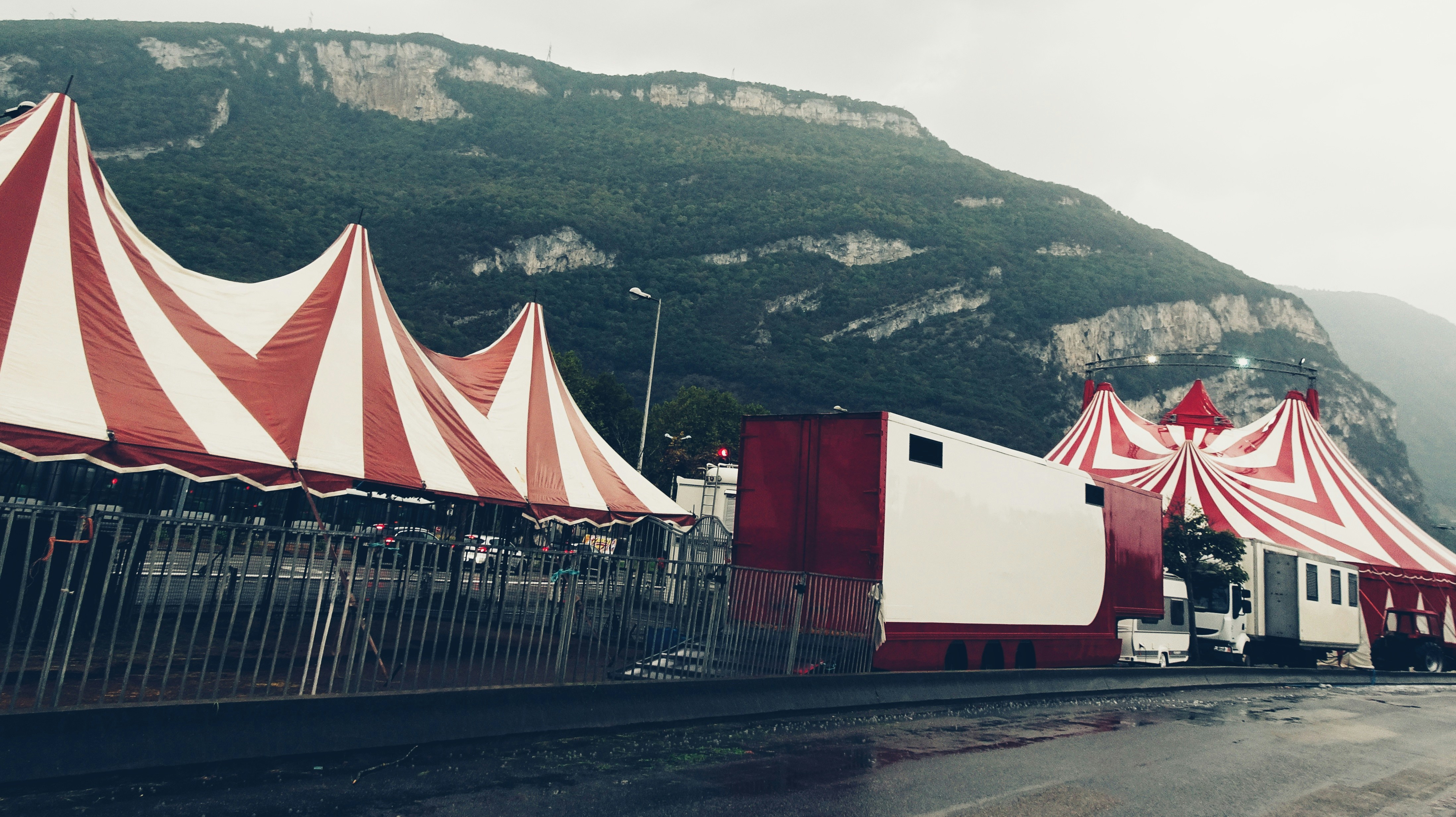 Circus tents in front of a mountain