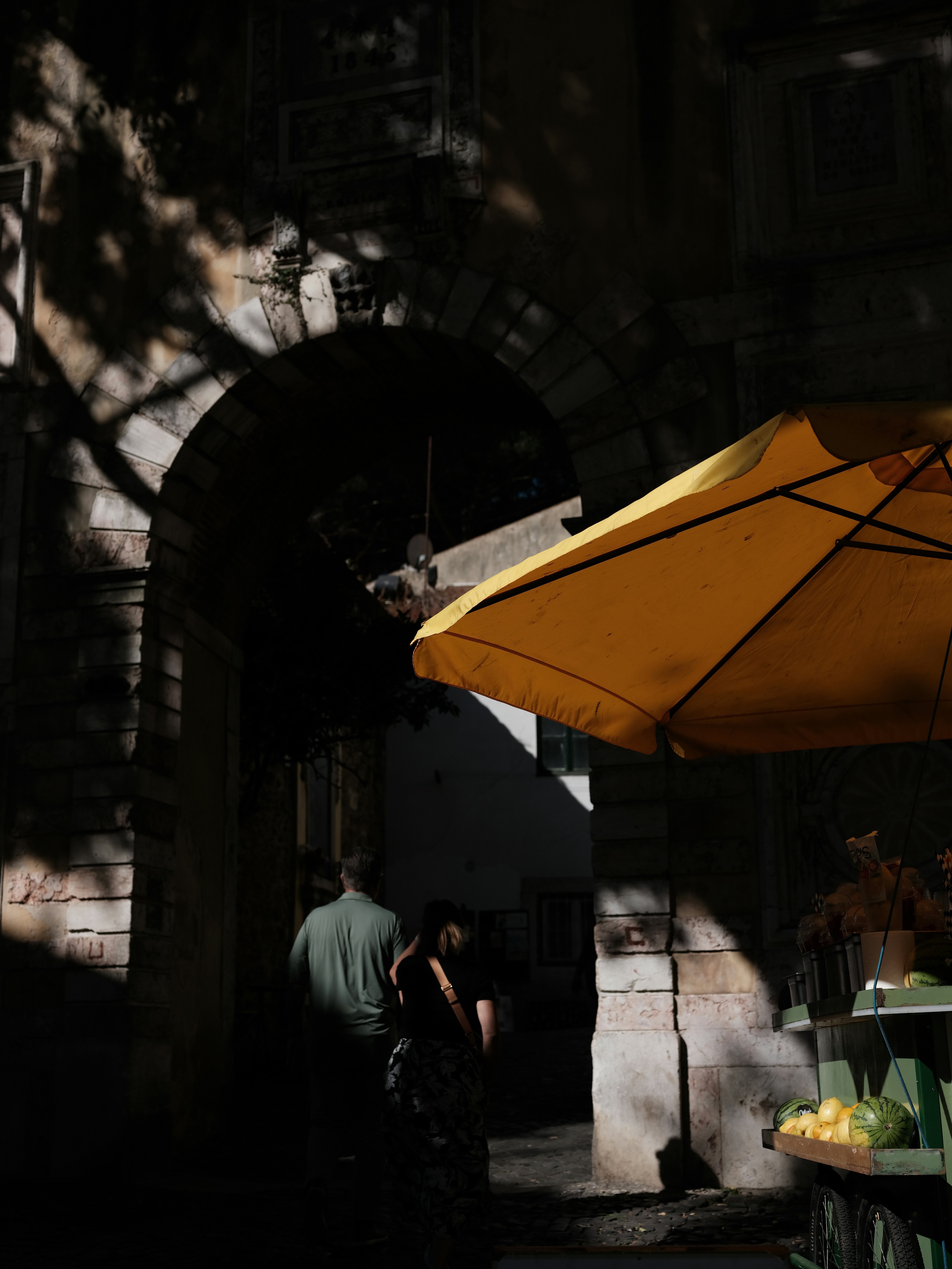 Sunlit Umbrella Amidst Shadows