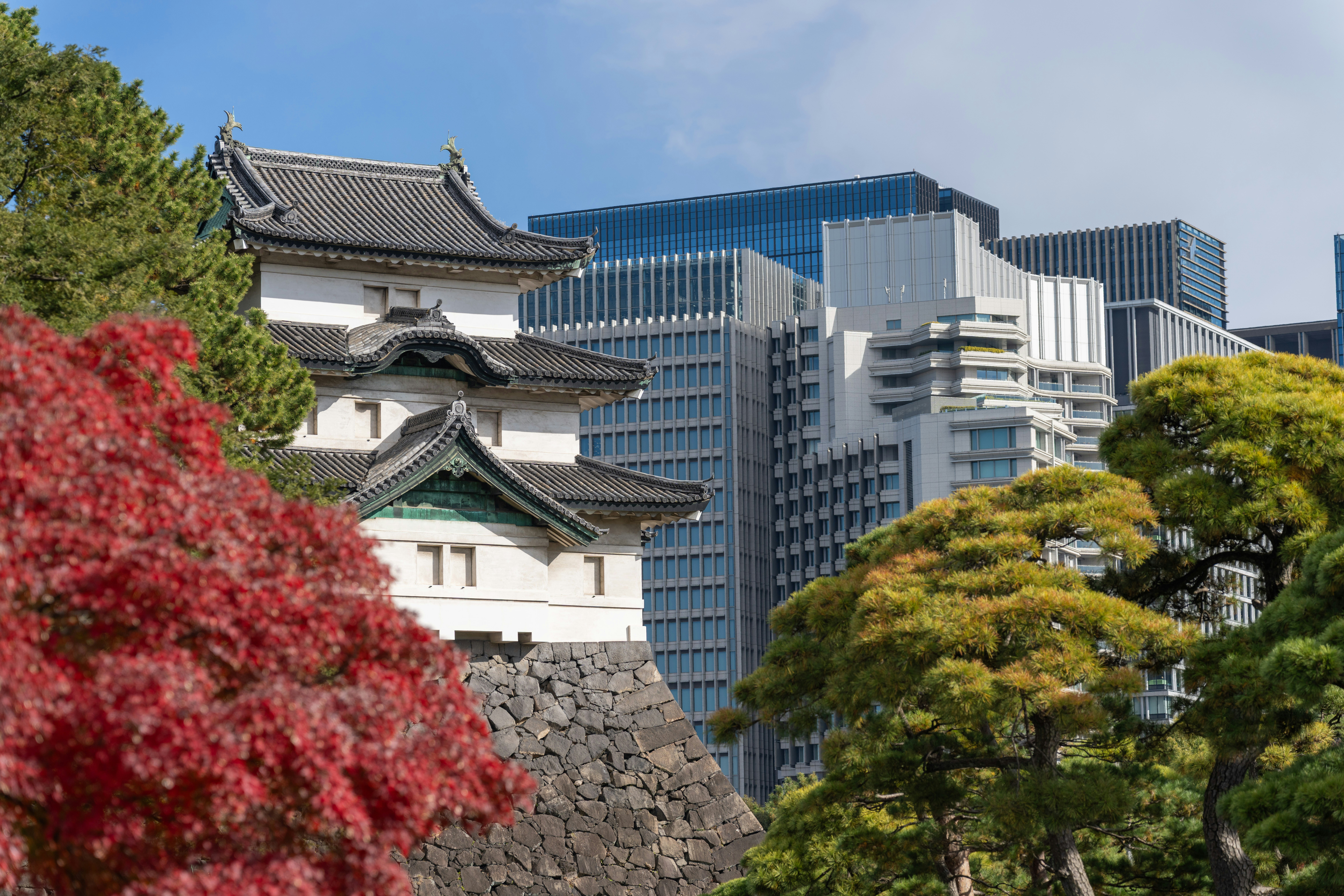 Traditional japanese castle with modern buildings behind