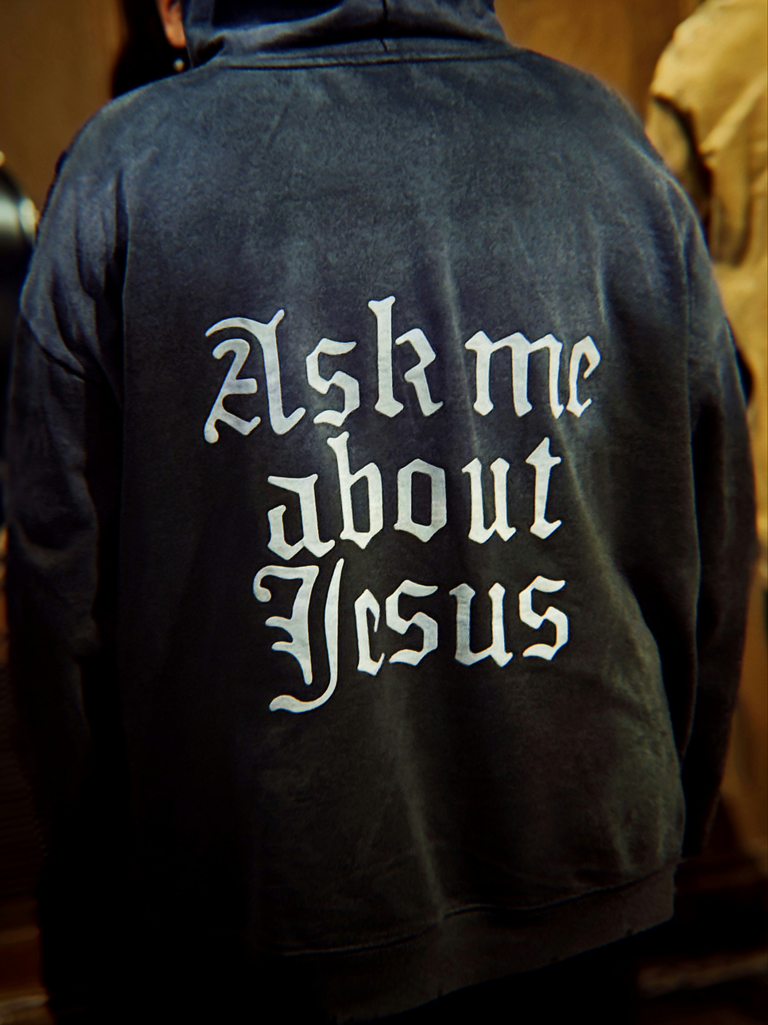 Created with RNI Films app. Profile 'Agfa RSX II v.2' | Back of hoodie with "ask me about jesus" text.