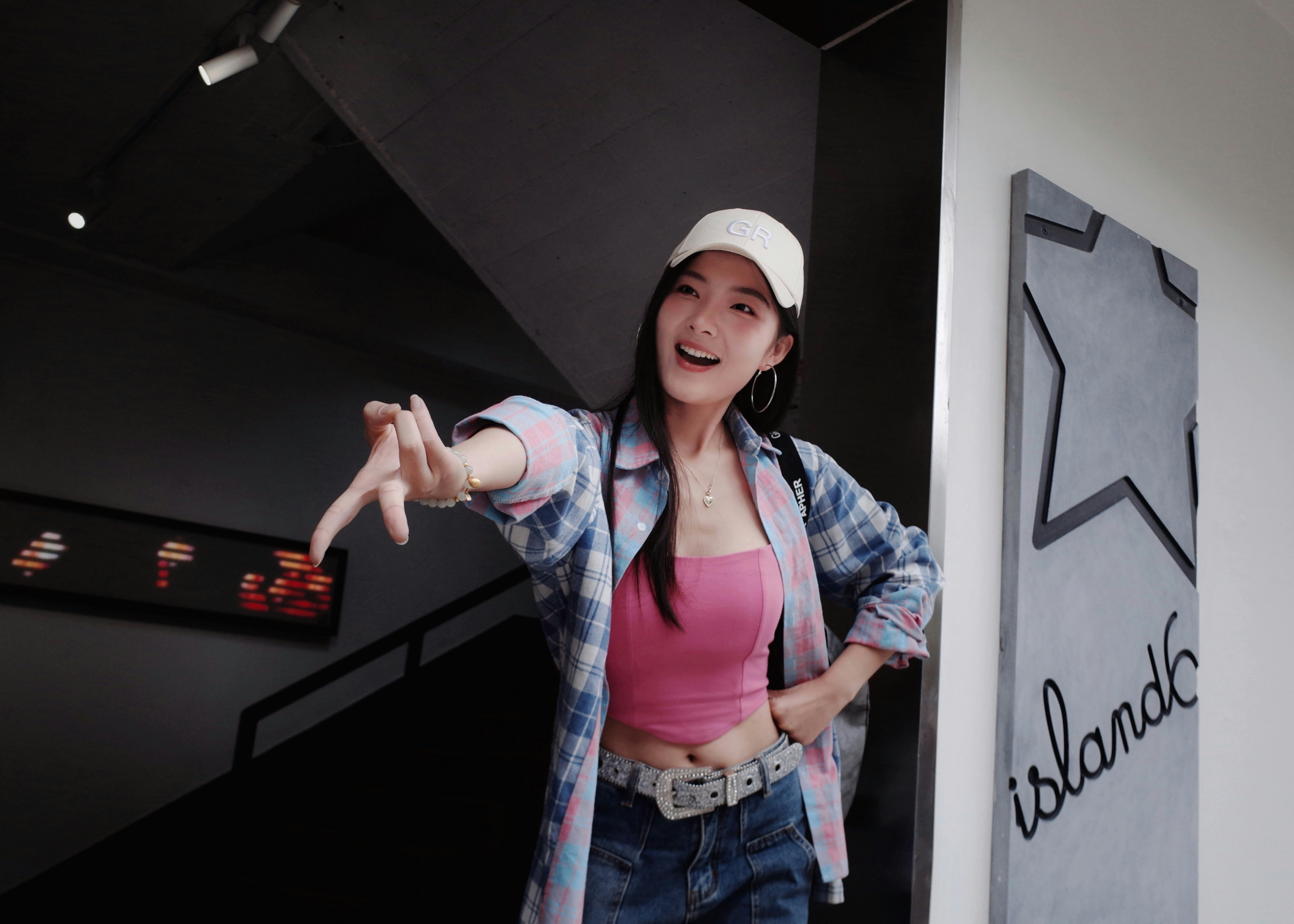 Young woman in casual clothes gesturing enthusiastically