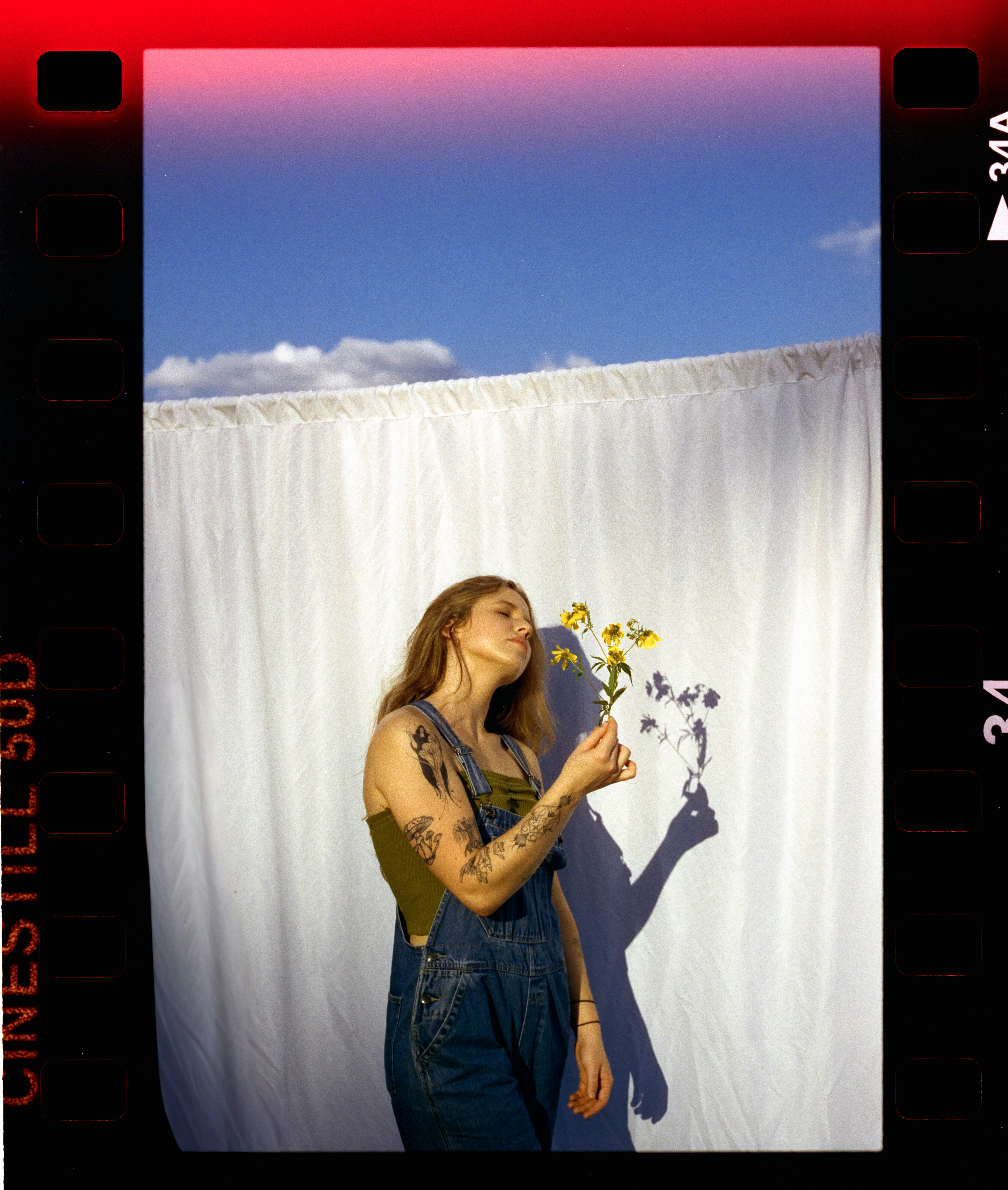 Denim Reverie: A Sunlit Portrait with Yellow Blooms