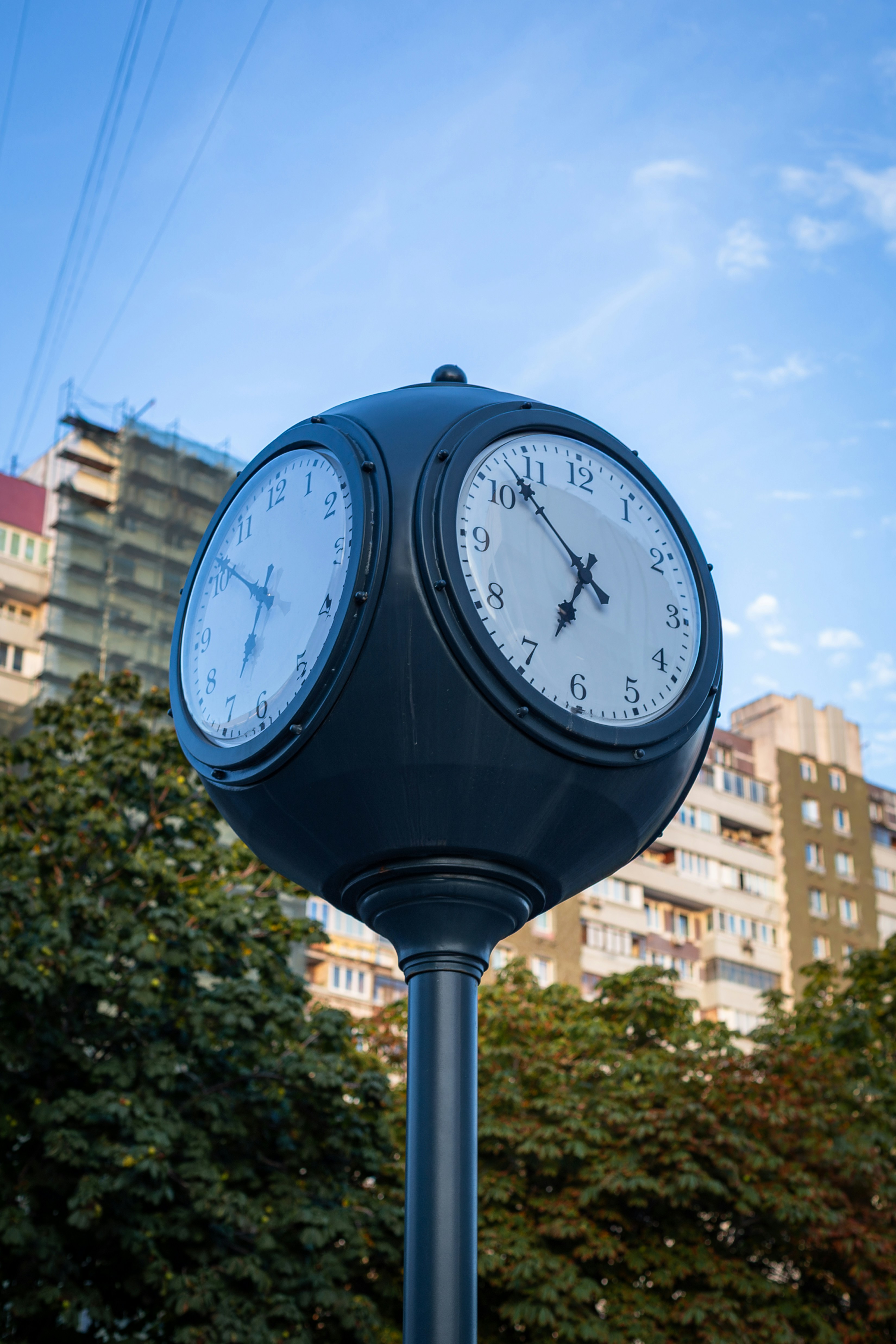 Timeless Elegance: A Vintage Clock Amidst Urban Life