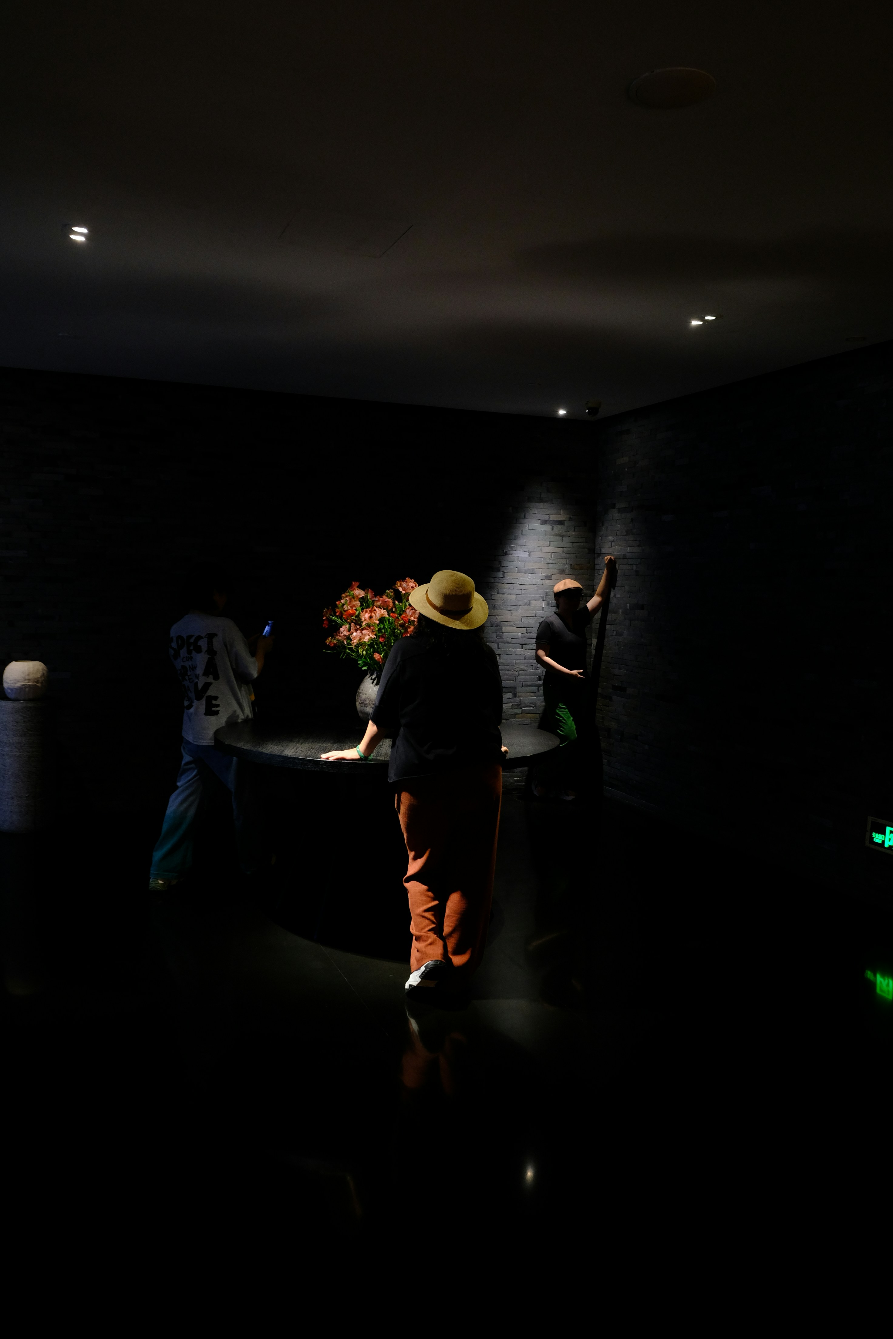 People gathered around a table with flowers