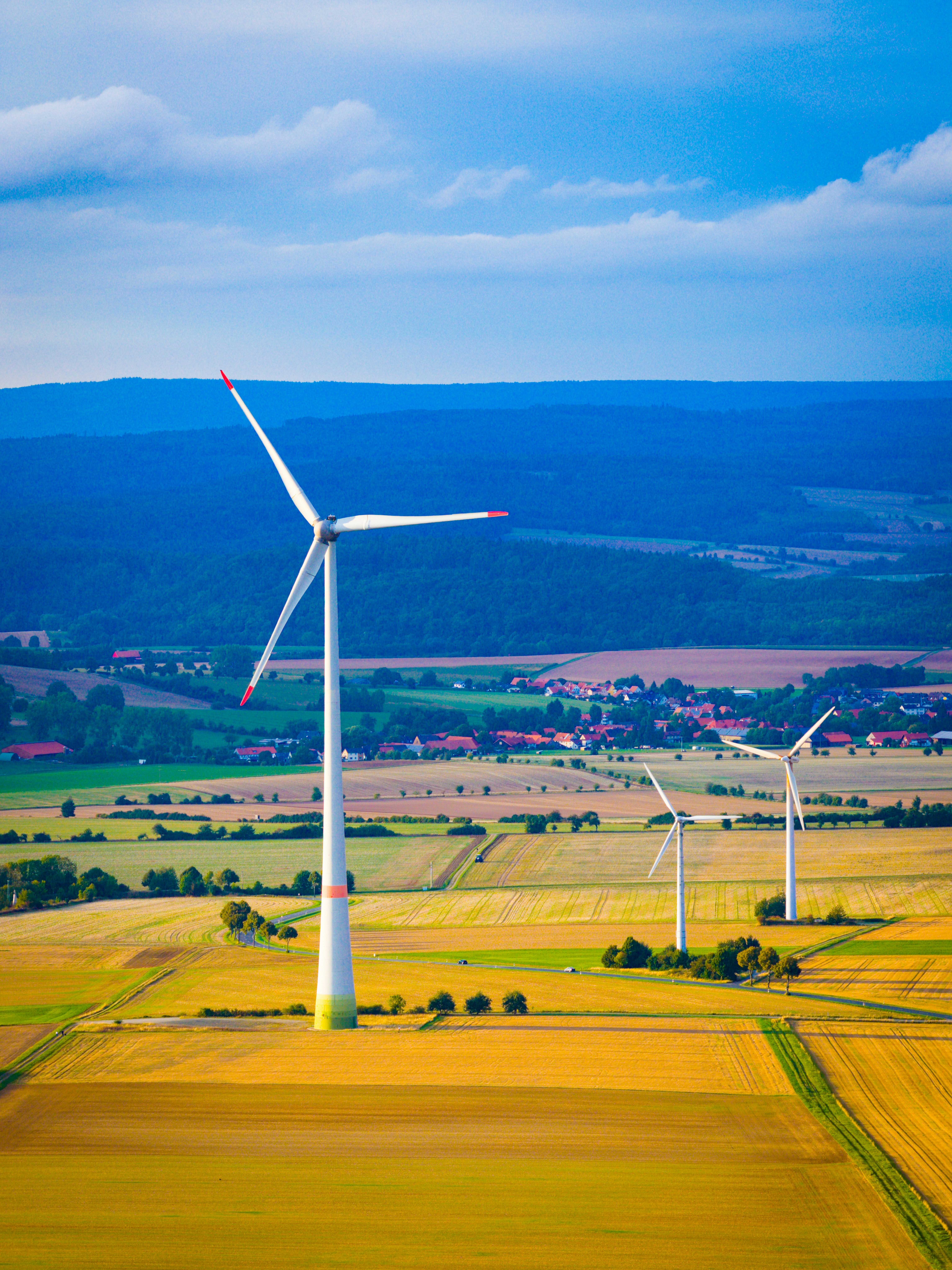 Harnessing Nature's Power: A Wind Farm Above the Fields