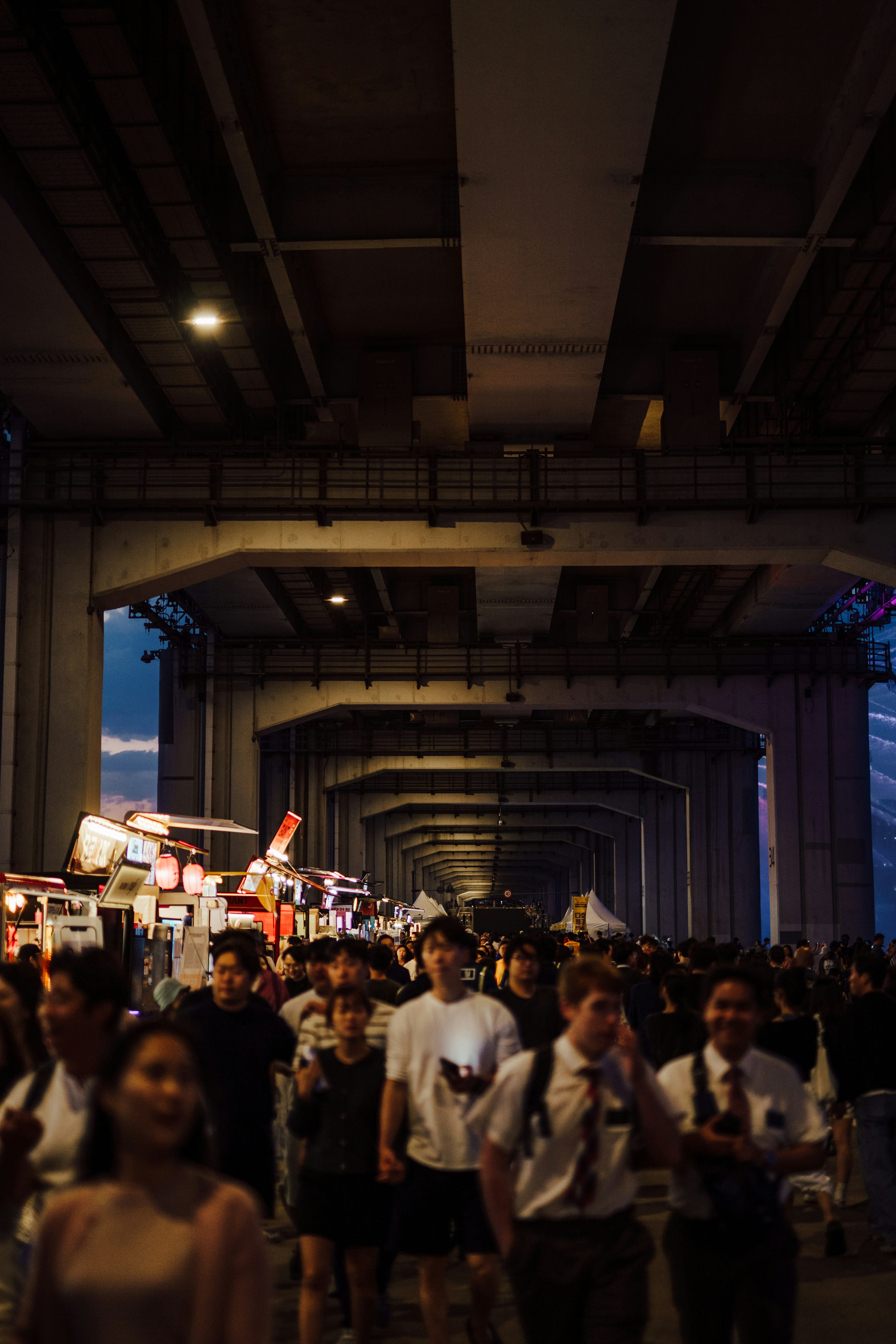 Urban Pulse: A Night Market Under Concrete Giants